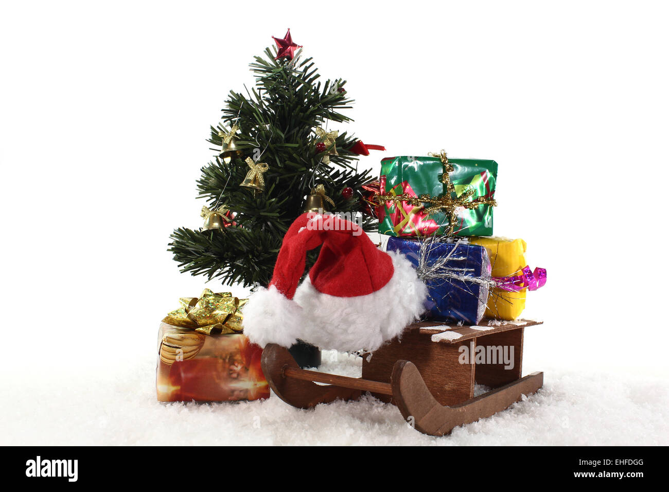 sledge and gifts under the christmas tree Stock Photo - Alamy