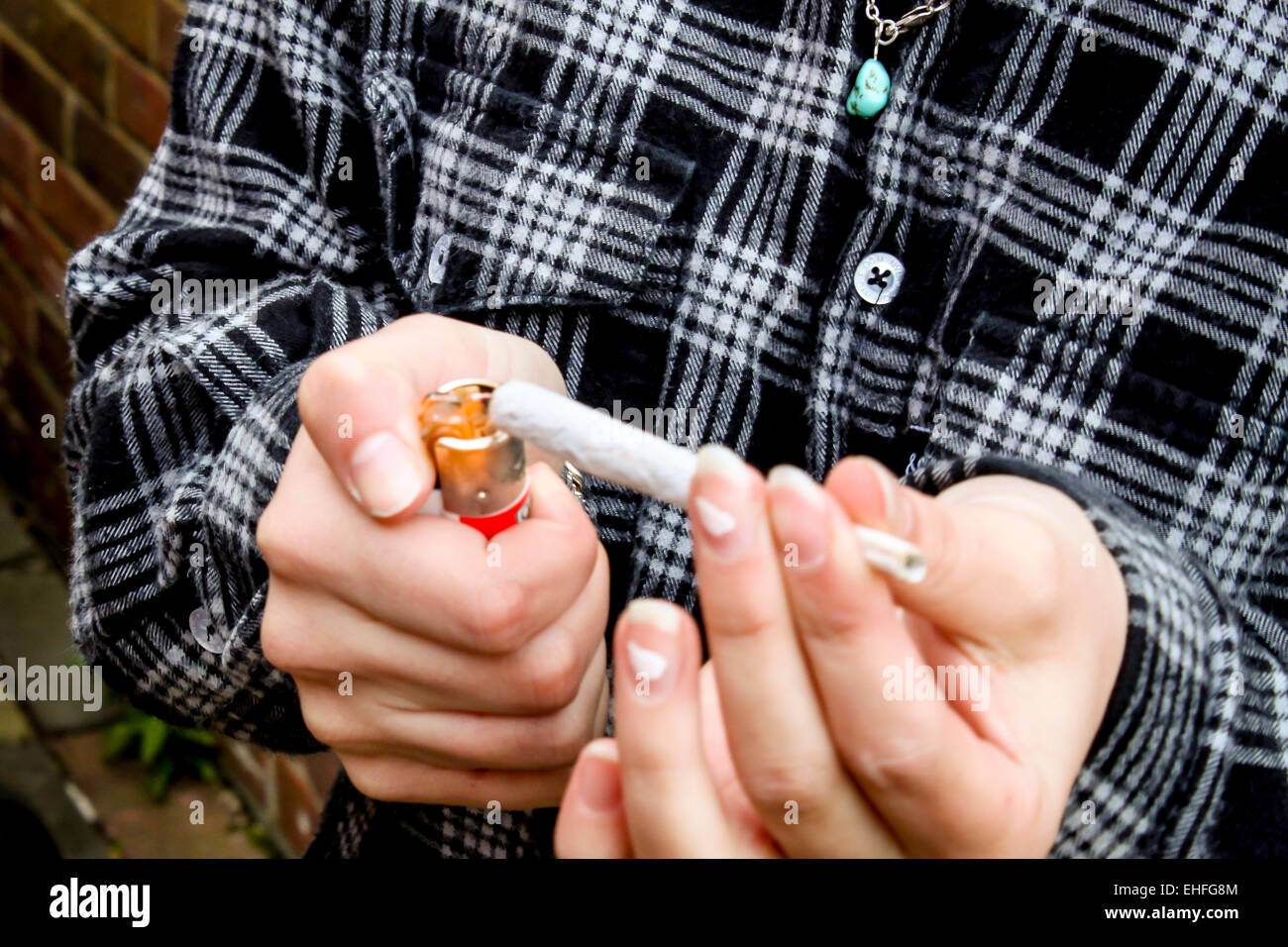 Close up of joint being lit model released Stock Photo - Alamy
