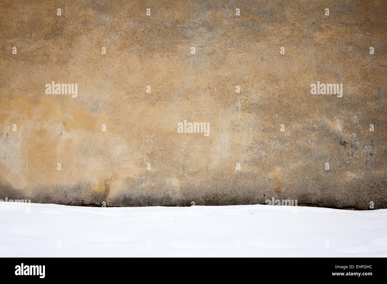 Old wall and a ground covered with snow Stock Photo - Alamy