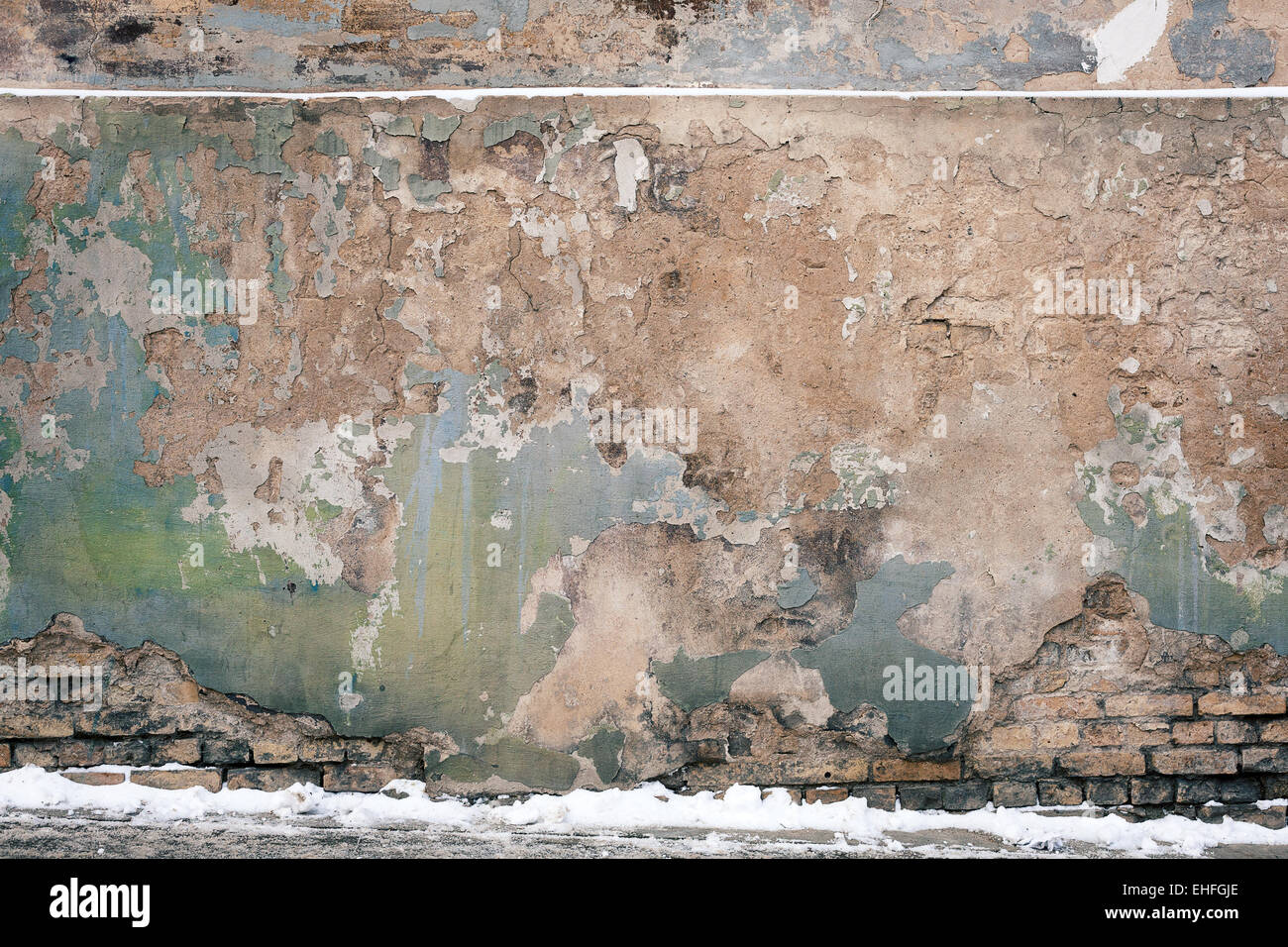 Old wall and a ground covered with snow Stock Photo - Alamy