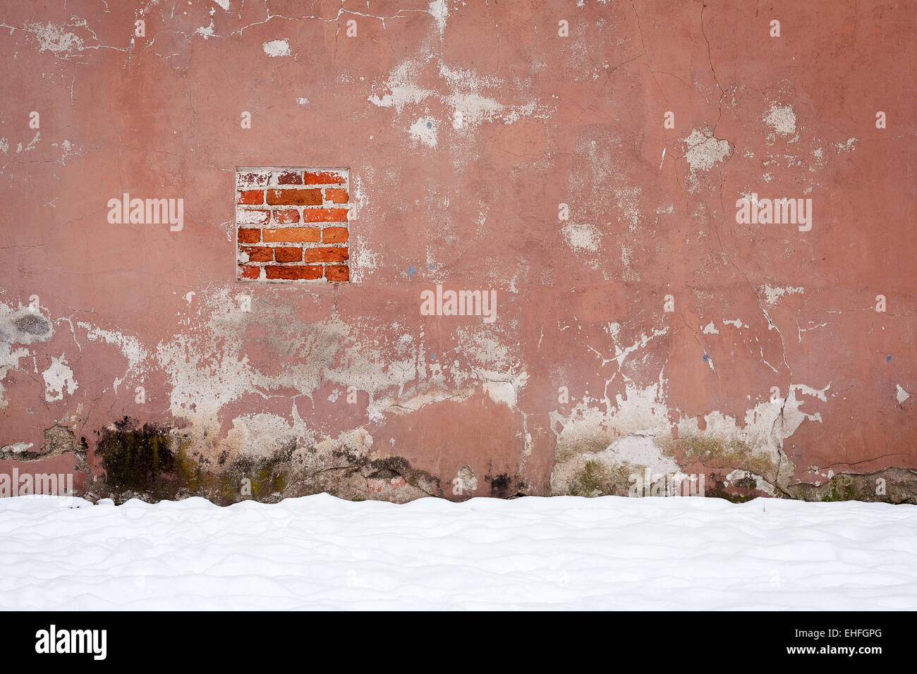Old wall of red bricks and a ground covered with snow Stock Photo - Alamy