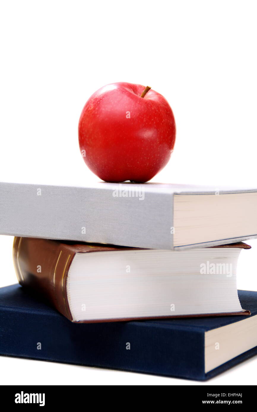 Stack of books and apple Stock Photo - Alamy