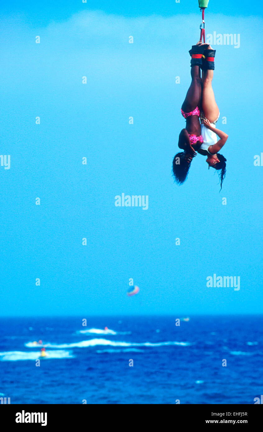 Two girls jumping in sea hi-res stock photography and images - Alamy