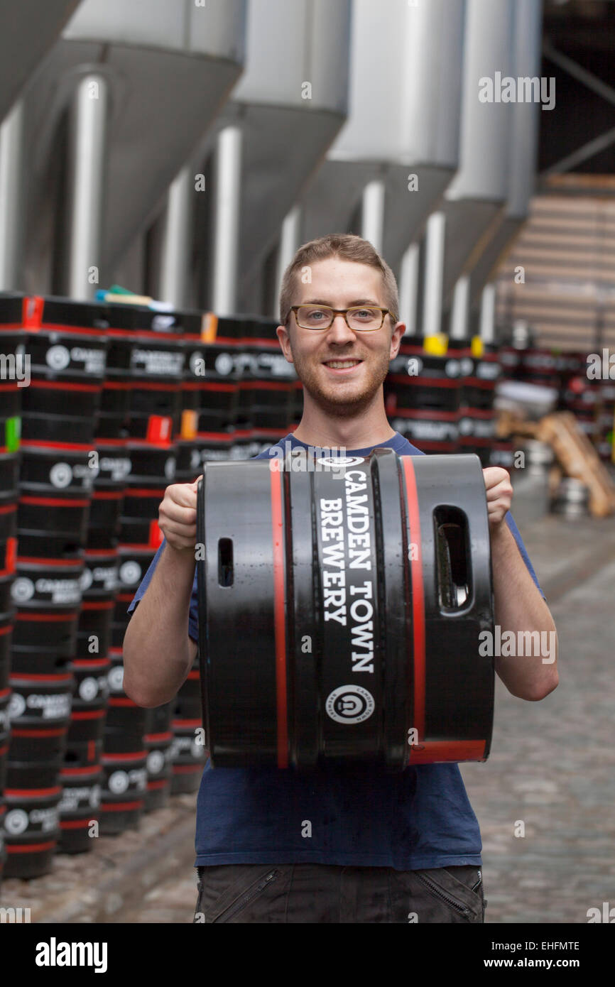 Staff holding Beer Barrel at the Camden Town Brewery London Stock Photo ...