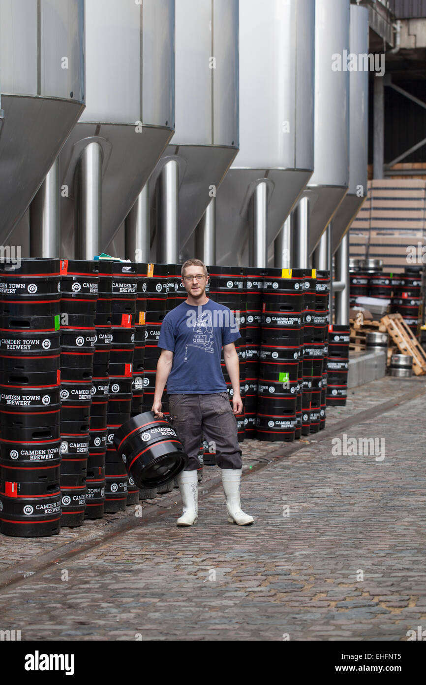 Staff holding Beer Barrel at the Camden Town Brewery London Stock Photo ...