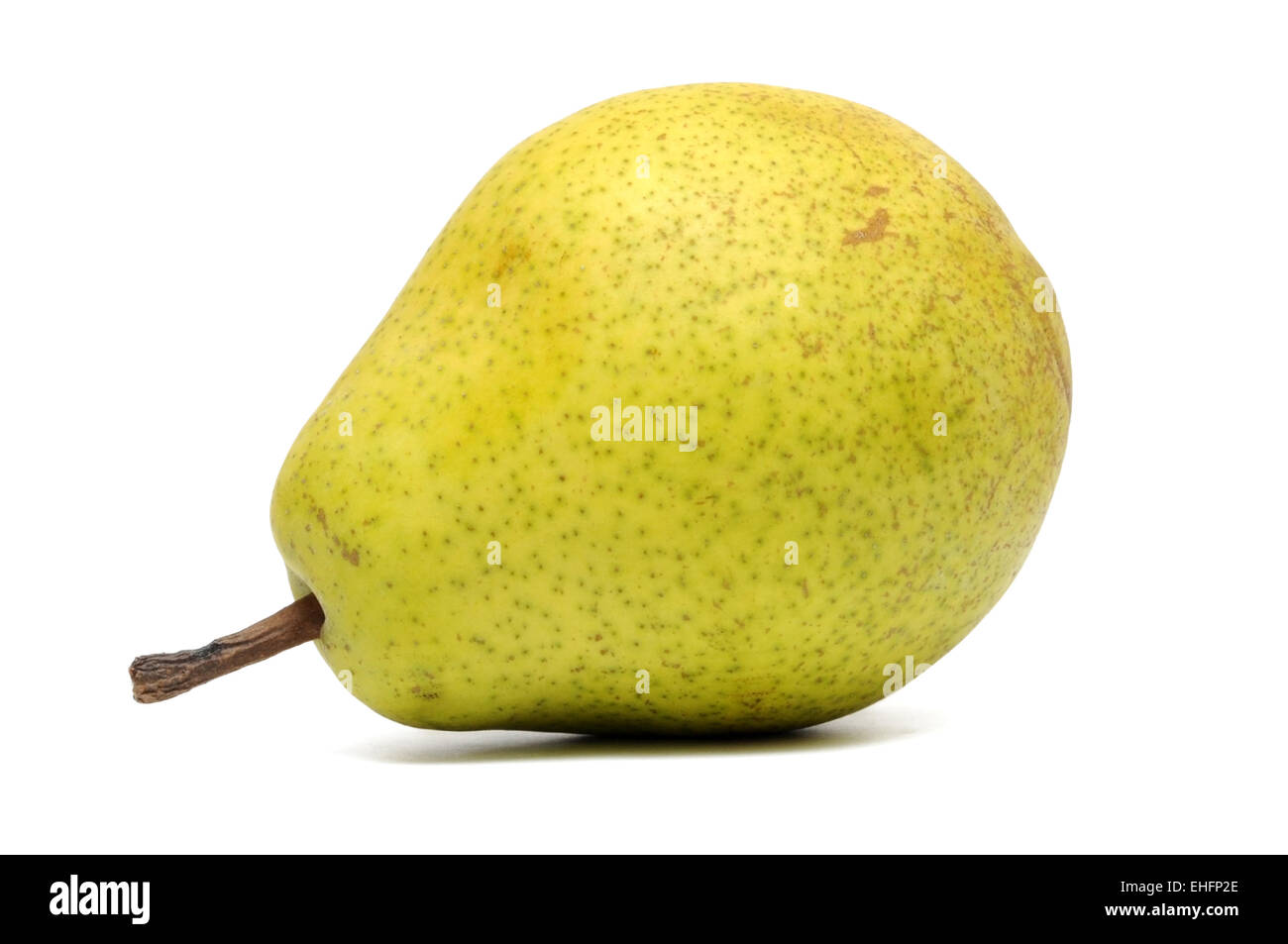Yellow-green pear on a white background Stock Photo - Alamy