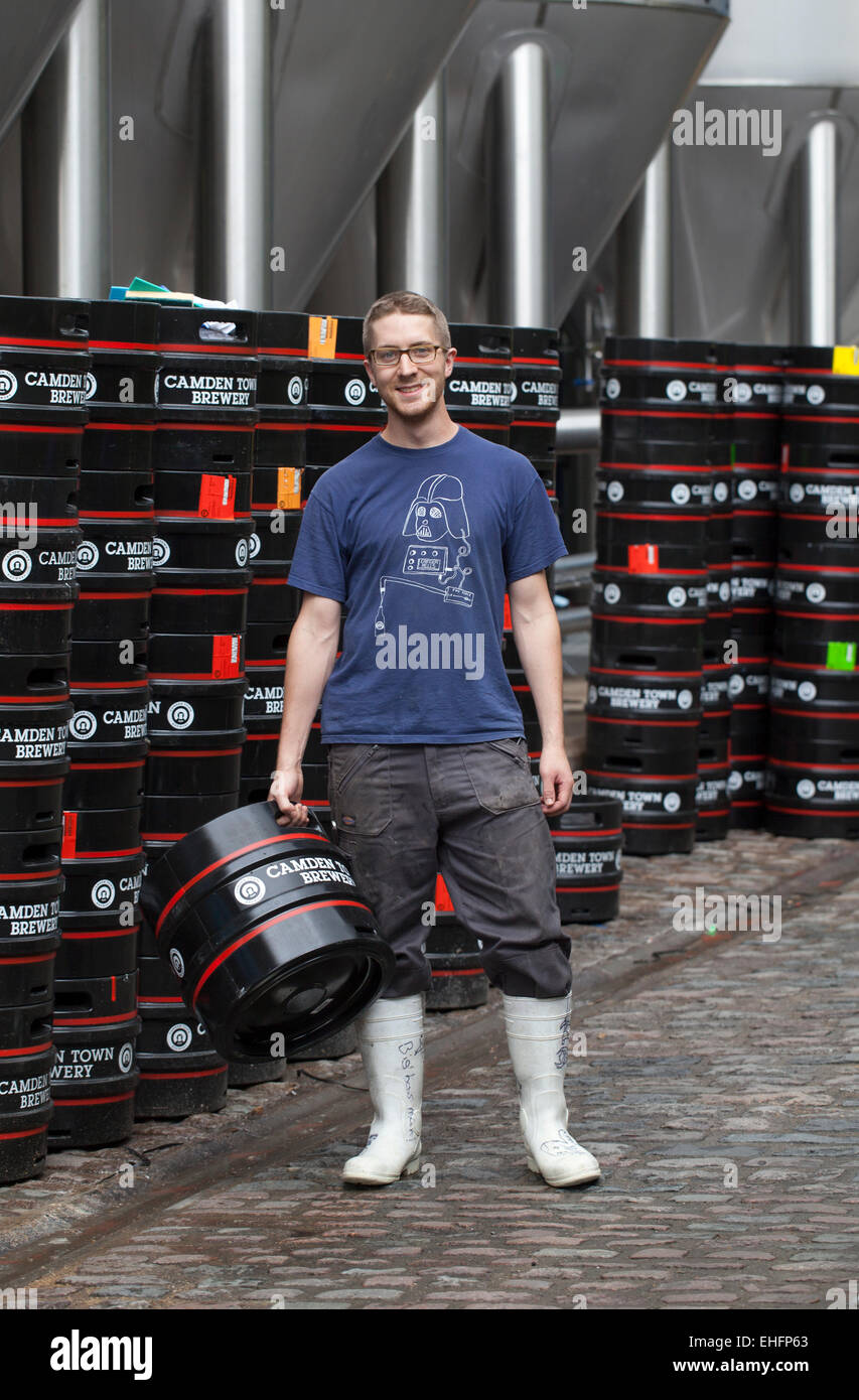 Staff holding Beer Barrel at the Camden Town Brewery London Stock Photo ...