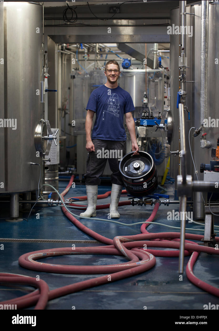 Staff holding Beer Barrel at the Camden Town Brewery London Stock Photo ...