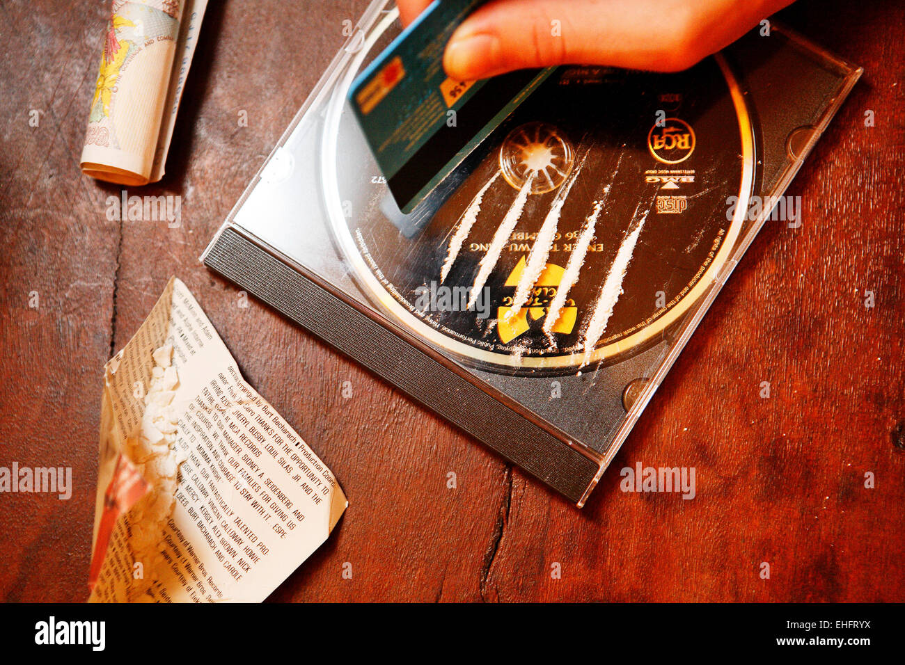 Taking Cocaine at a dinner party London Stock Photo - Alamy