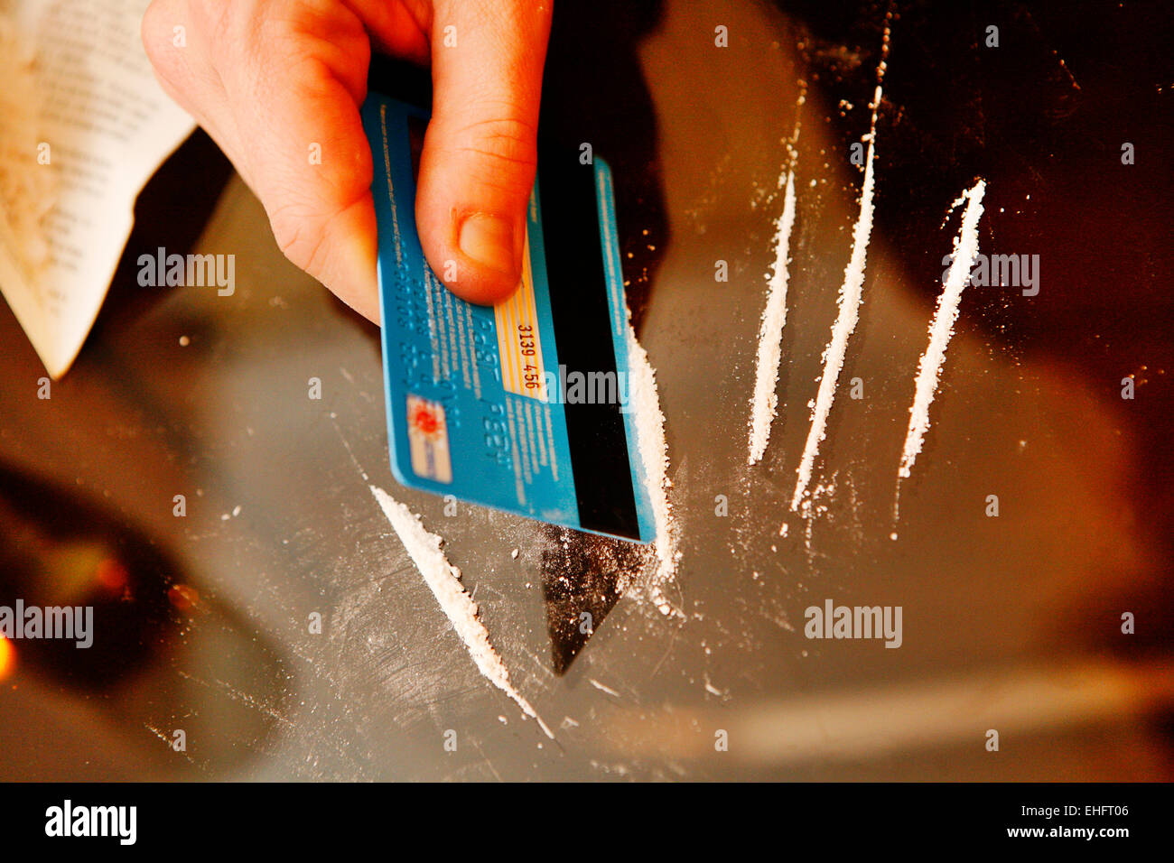 Taking Cocaine at a dinner party London Stock Photo - Alamy