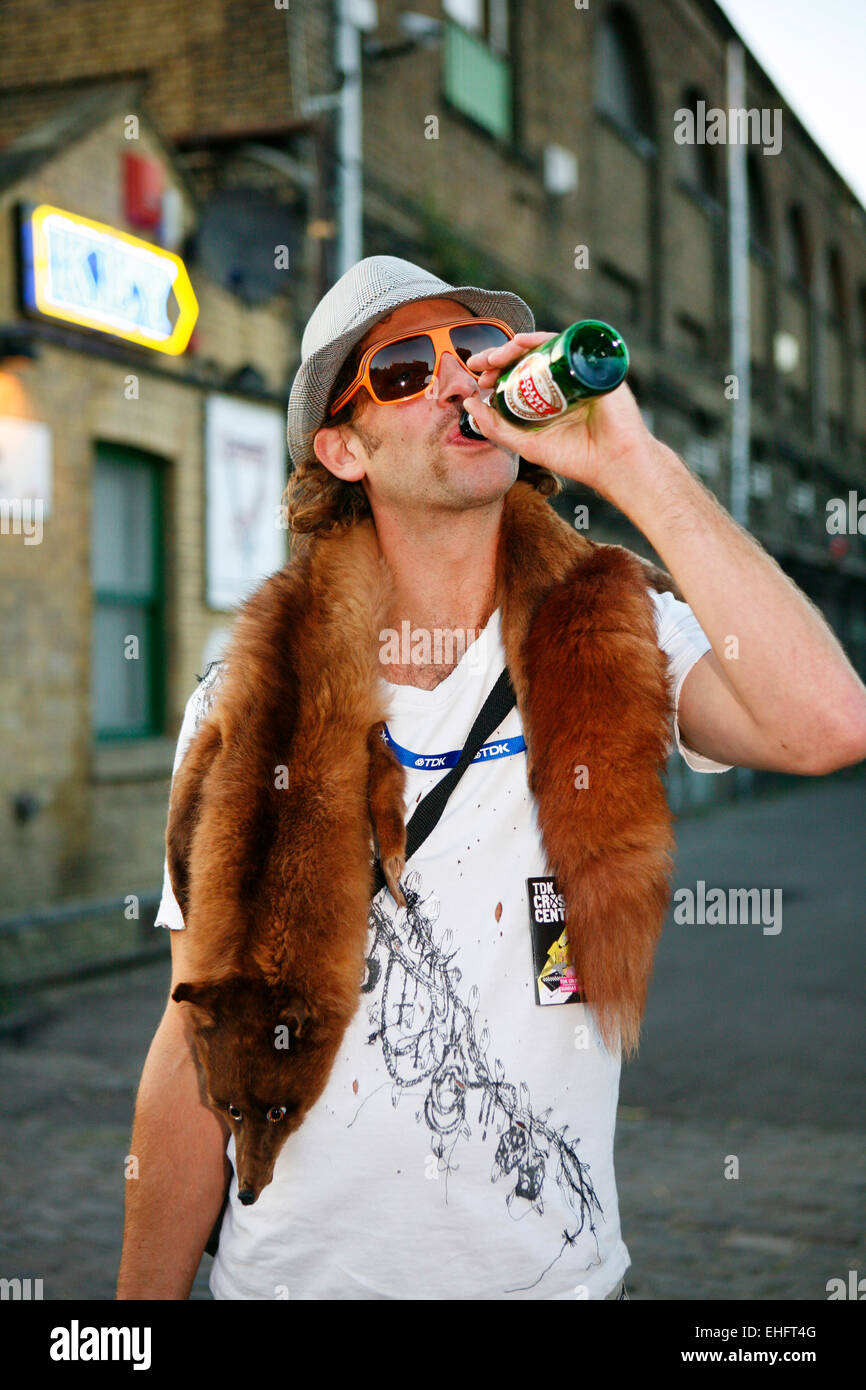 Guy wearing a fake fox around his neck at TDK Cross Central Festival ...