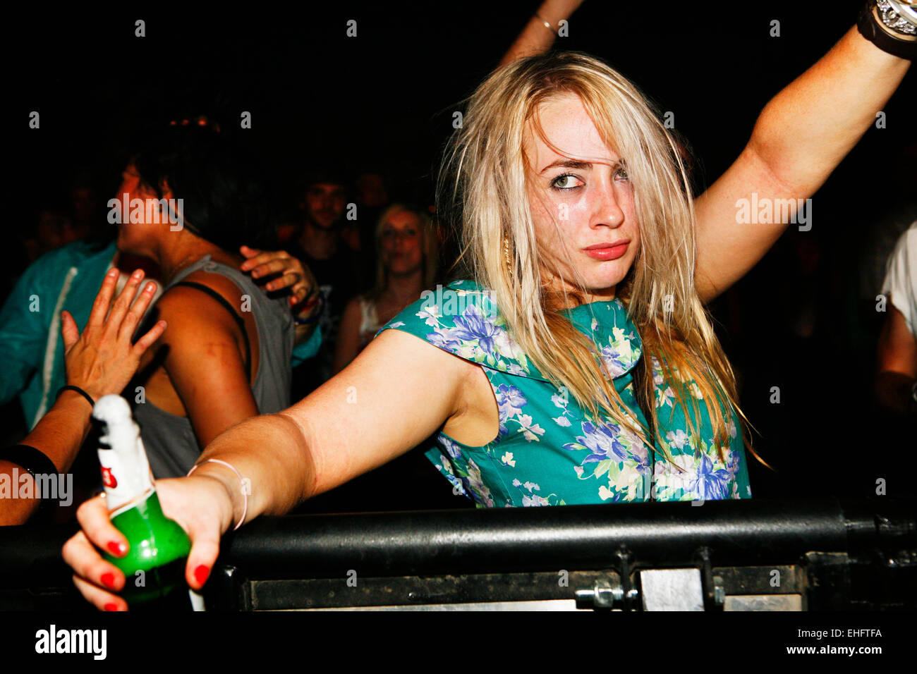 Girl dancing with a beer at TDK Cross Central Festival 2007 at Canvas ...
