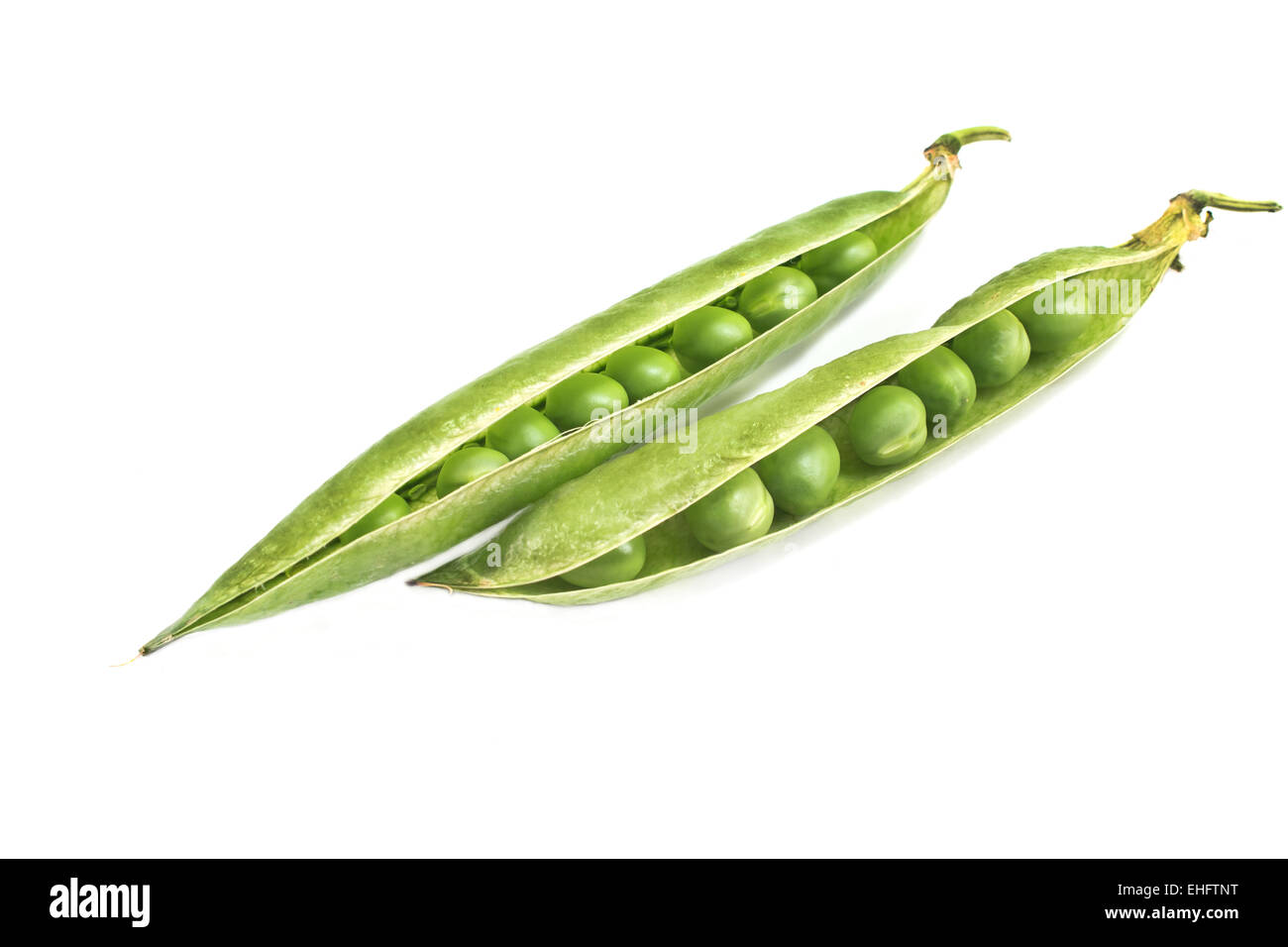 Fresh green peas isolated on a white Stock Photo - Alamy