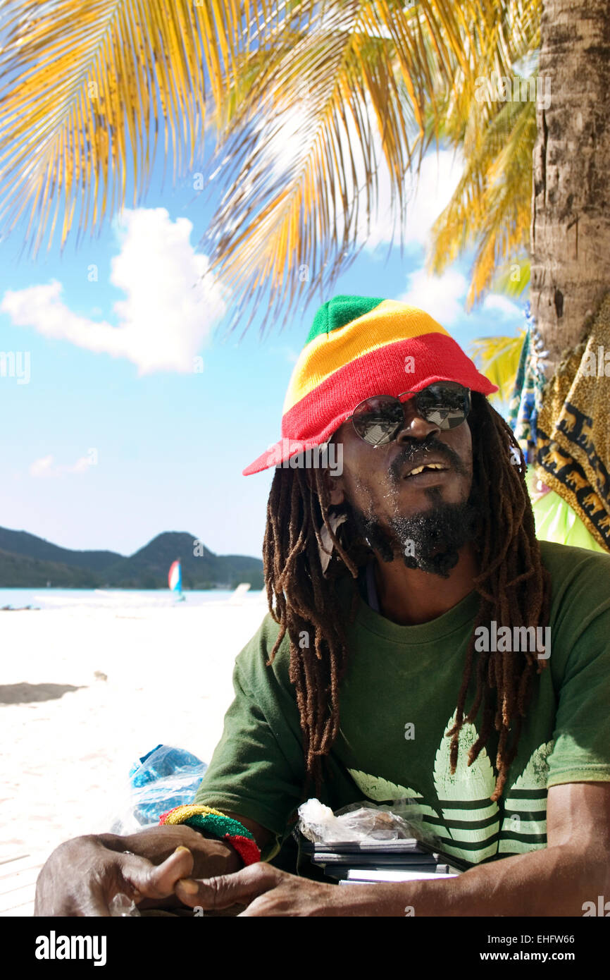 Rasta man on Jolly beach Antigua Stock Photo - Alamy