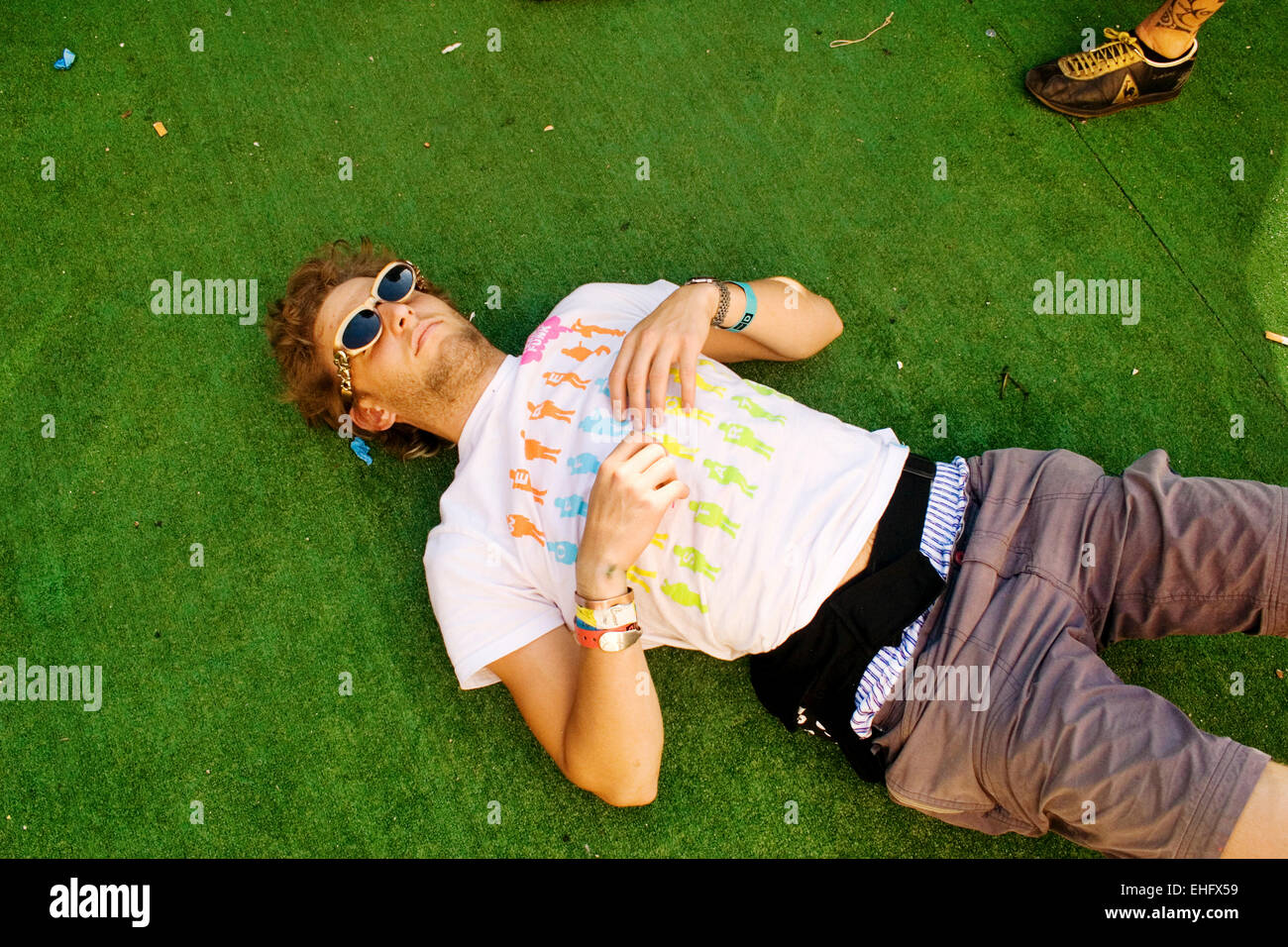 Guy chilling on the floor at Sonar by Day Barcelona Stock Photo - Alamy