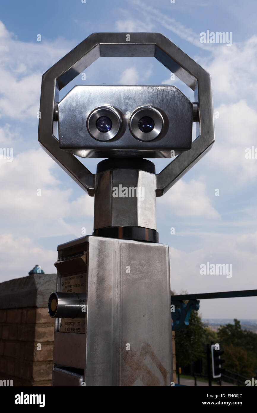 Close-up view of a stainless-steel, coin-operated, binocular telescope ...