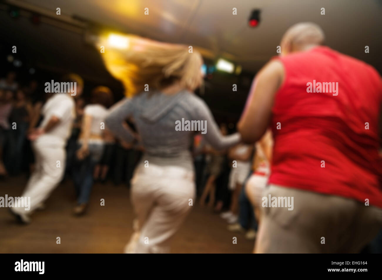People dancing at the party abstract blur background with bokeh Stock ...