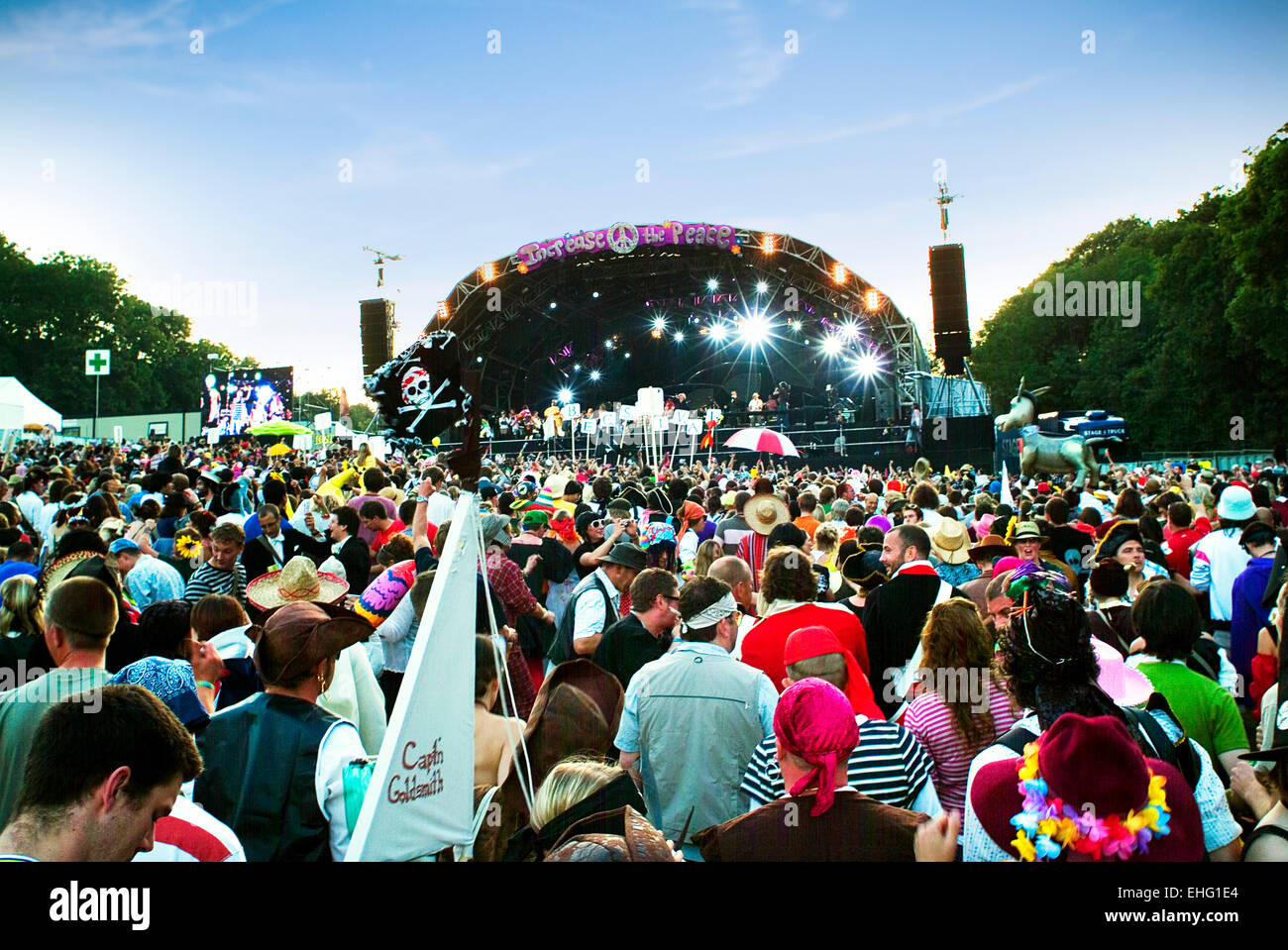 Crowd all in fancy dress looking towards the main stage at Bestival on ...
