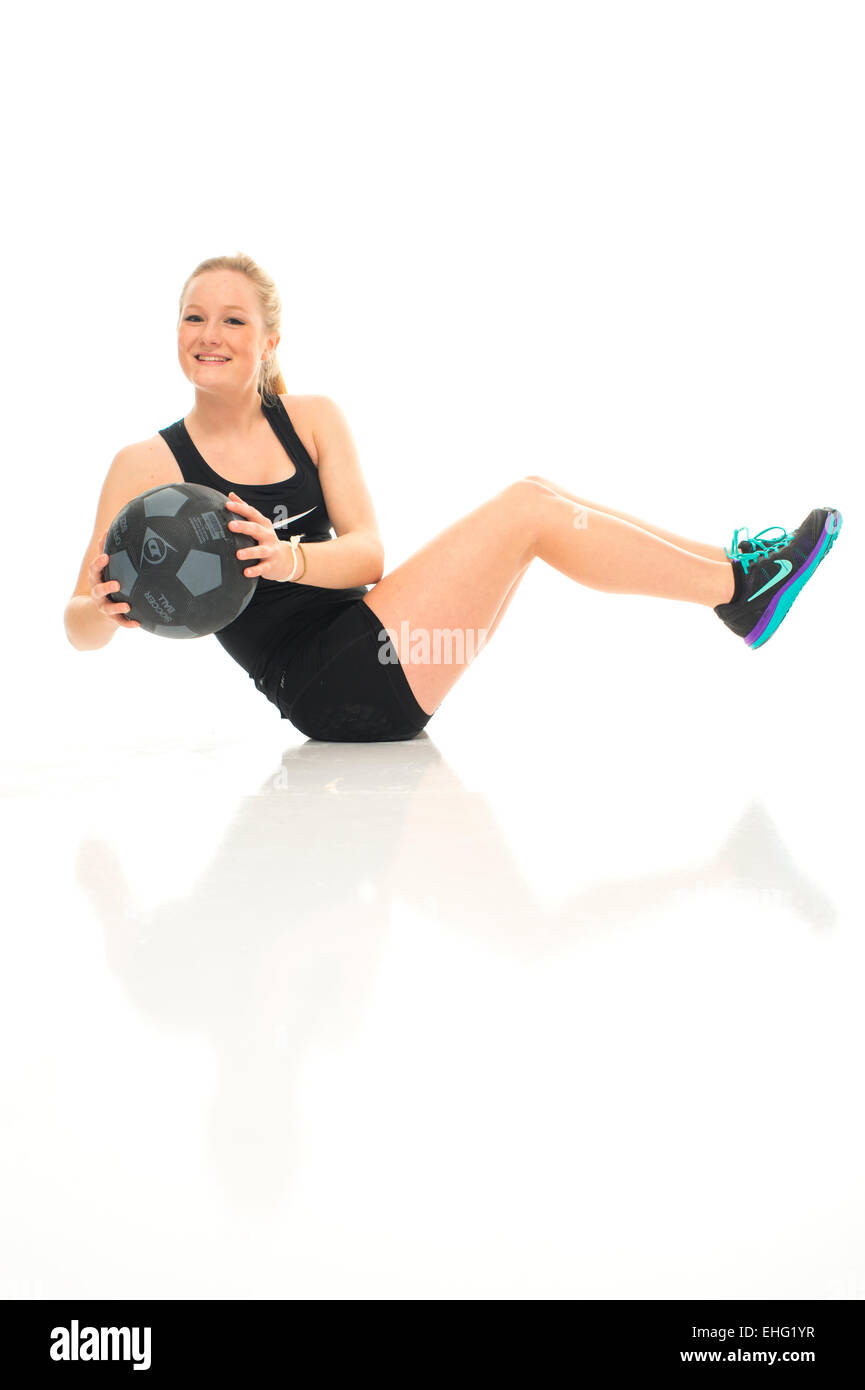 A young sporty fit woman 19 year old teenage girl wearing sportswear ...