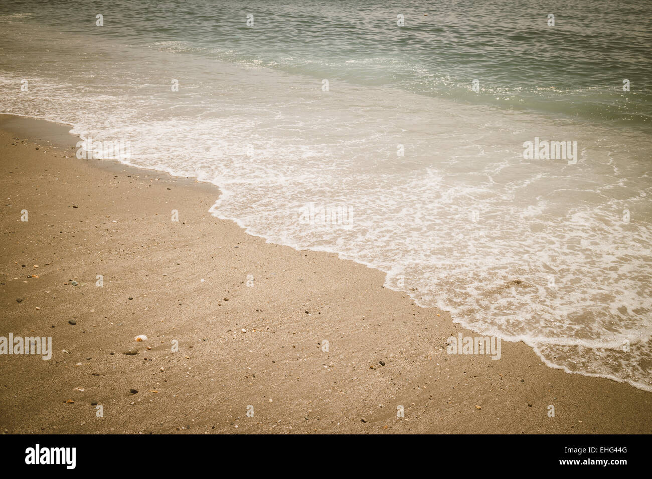 sand beach wave surf sea water vintage retro Stock Photo - Alamy