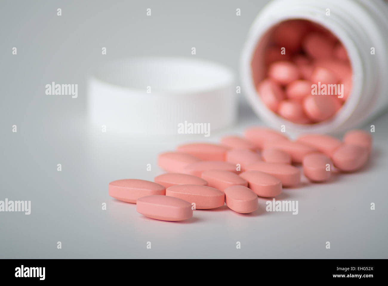 pink medicine pills Stock Photo - Alamy
