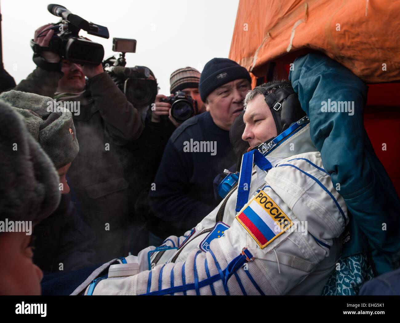 ISS Expedition 42 Cosmonaut Alexander Samokutyaev is carried to the ...