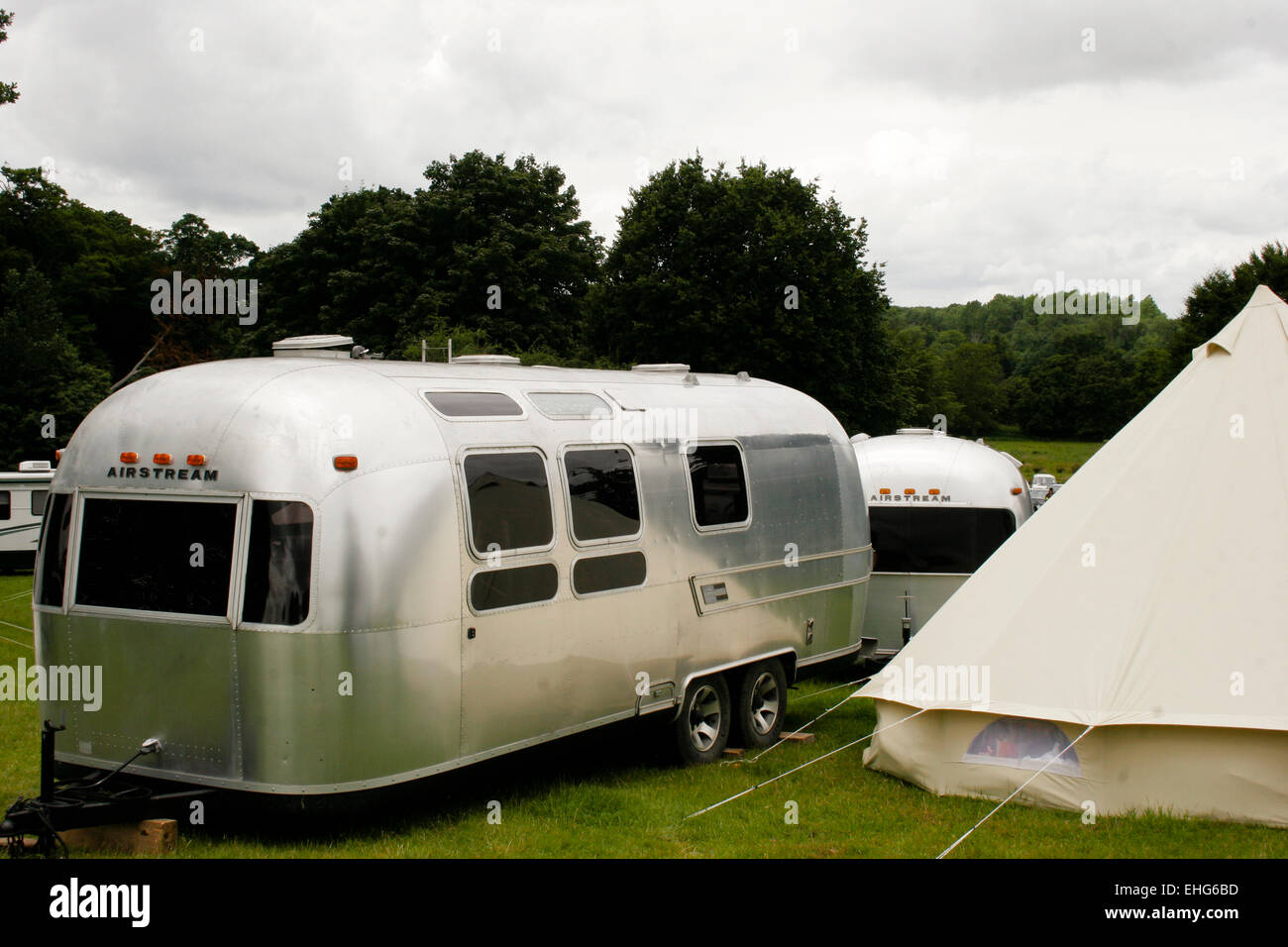 Iconic Airstream 'silver bullet' travel trailers at a festival in ...