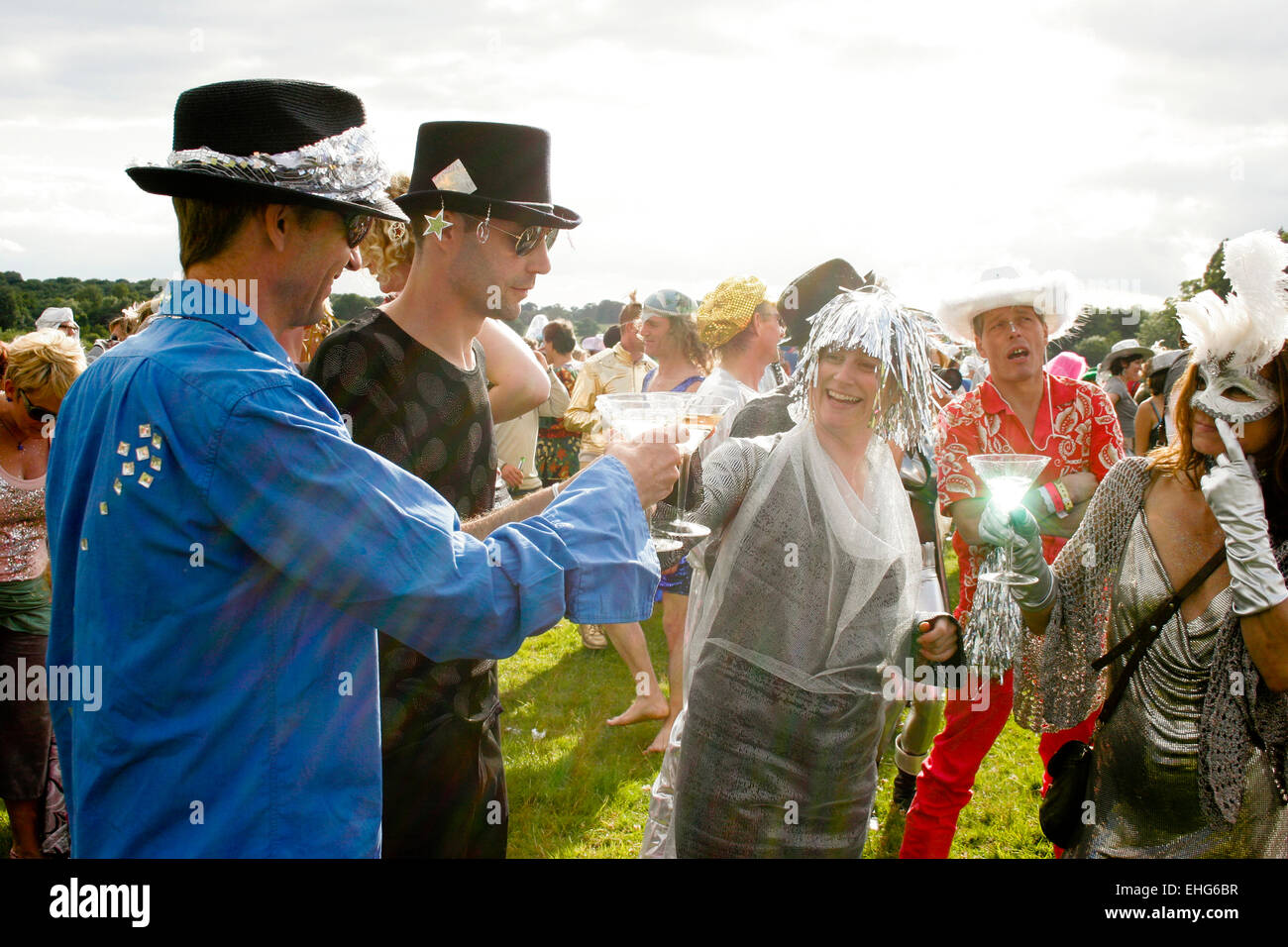Friends drinking champagne at a festival in England Stock Photo - Alamy