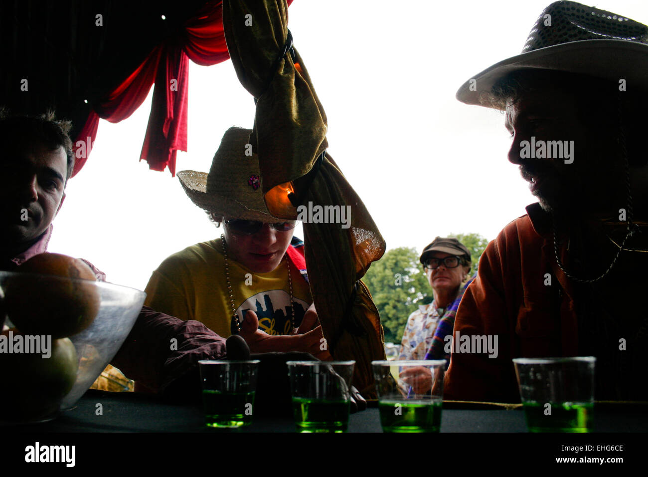 Guys drinking shots at the bar at a festival in England Stock Photo - Alamy