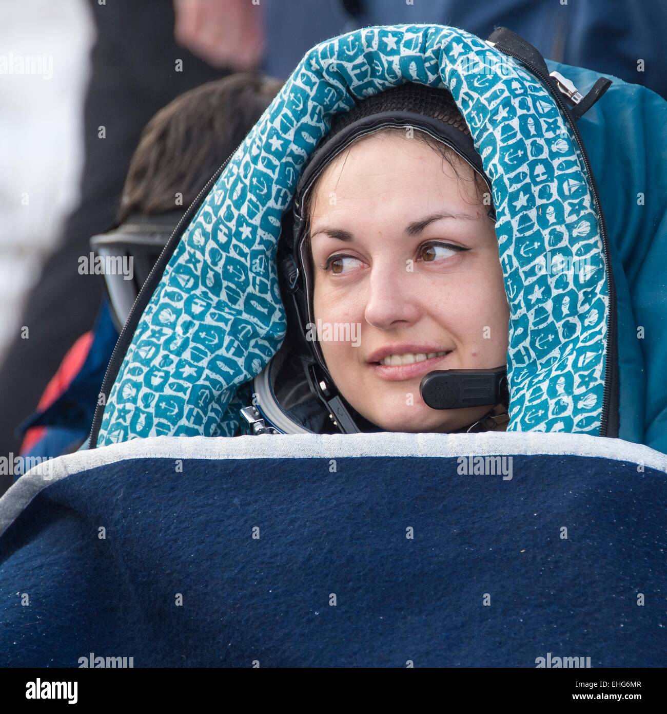ISS Expedition 42 Cosmonaut Elena Serova wrapped in a blanket outside ...