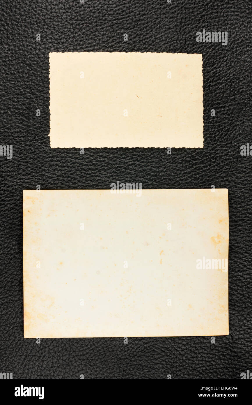 Old paper lying on black leather, as a frame, texture Stock Photo - Alamy