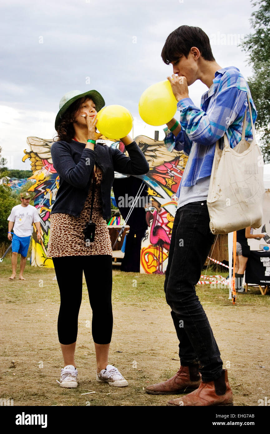 Couple at the Secret Garden festival inhaling Laughing gas from ...