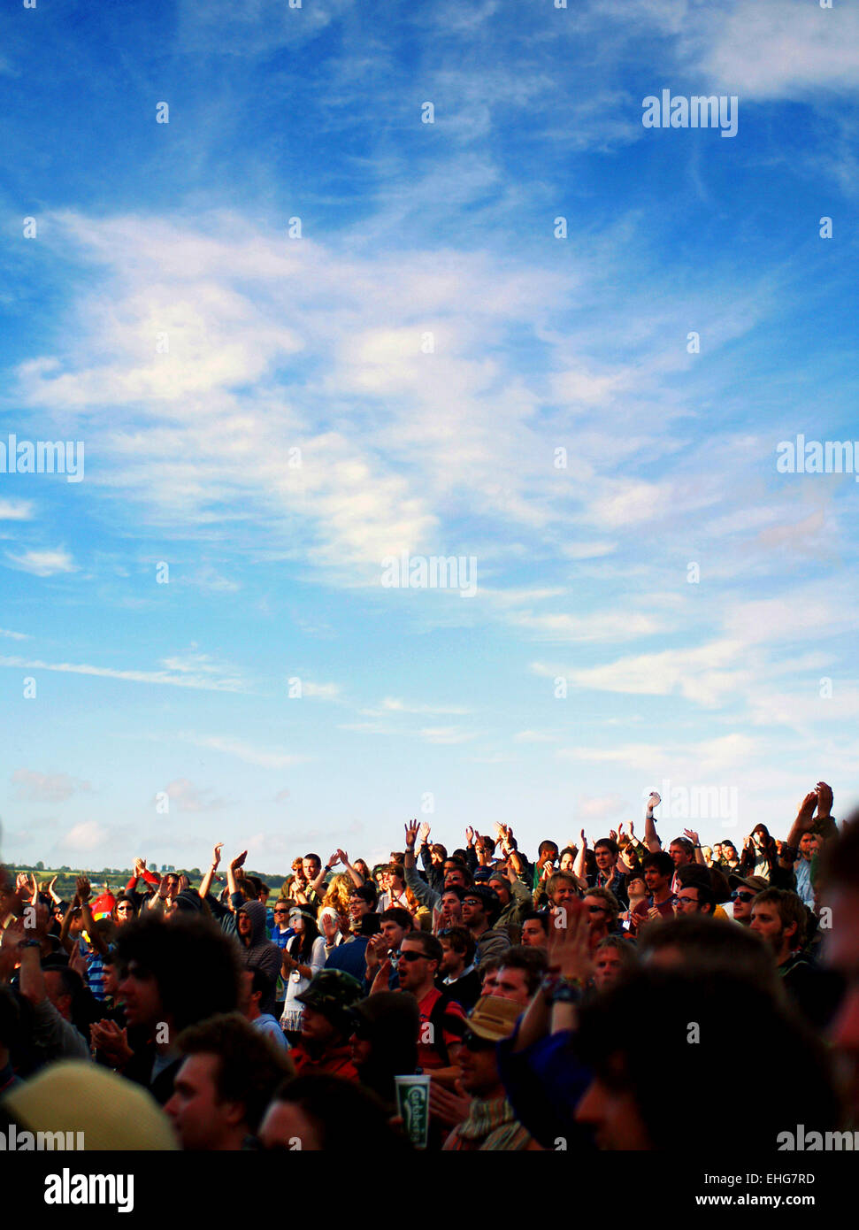 Crowd and blue sky at Glastonbury 2008 Stock Photo - Alamy
