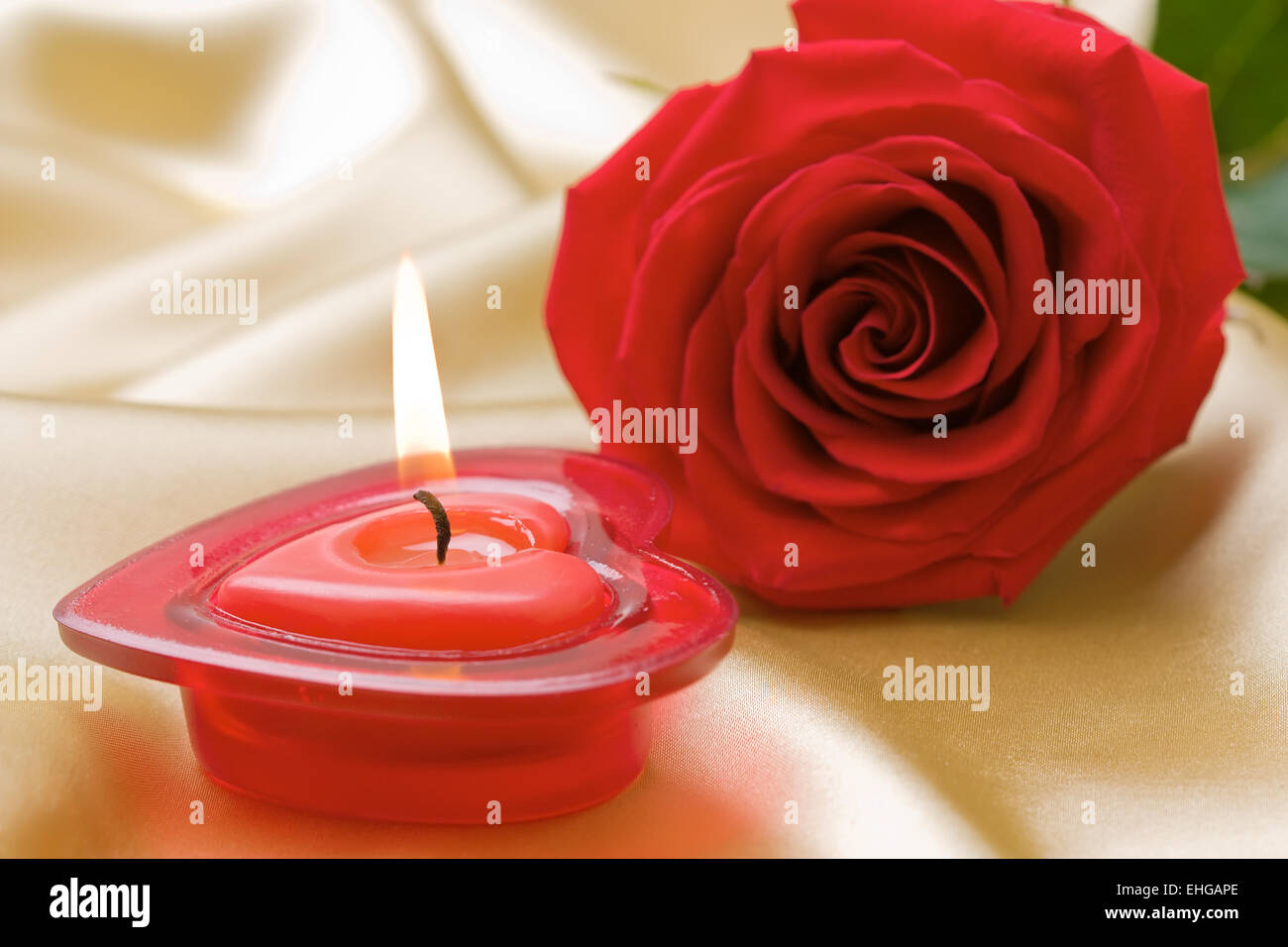 Aromatic candle and red rose Stock Photo - Alamy