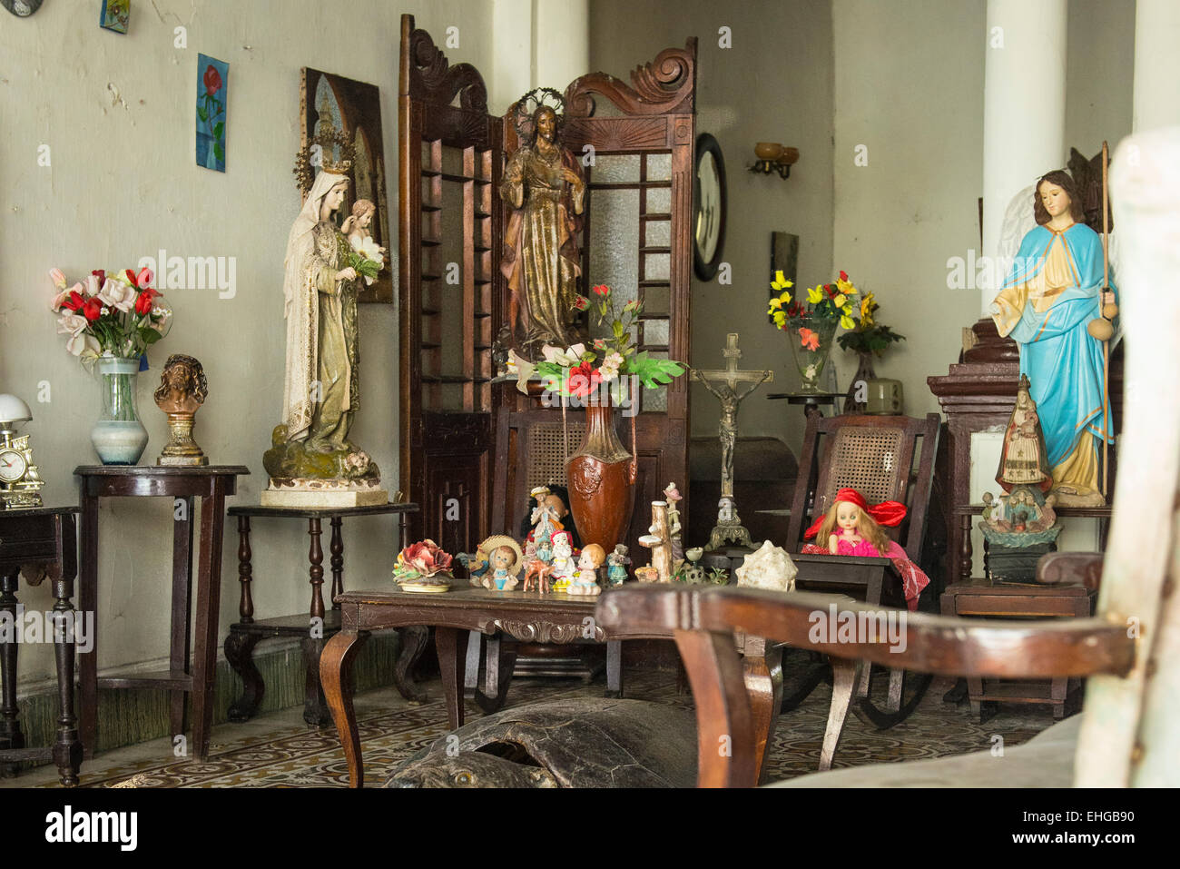 Cuba Santa Clara private house home with religious memorabilia trinkets ...