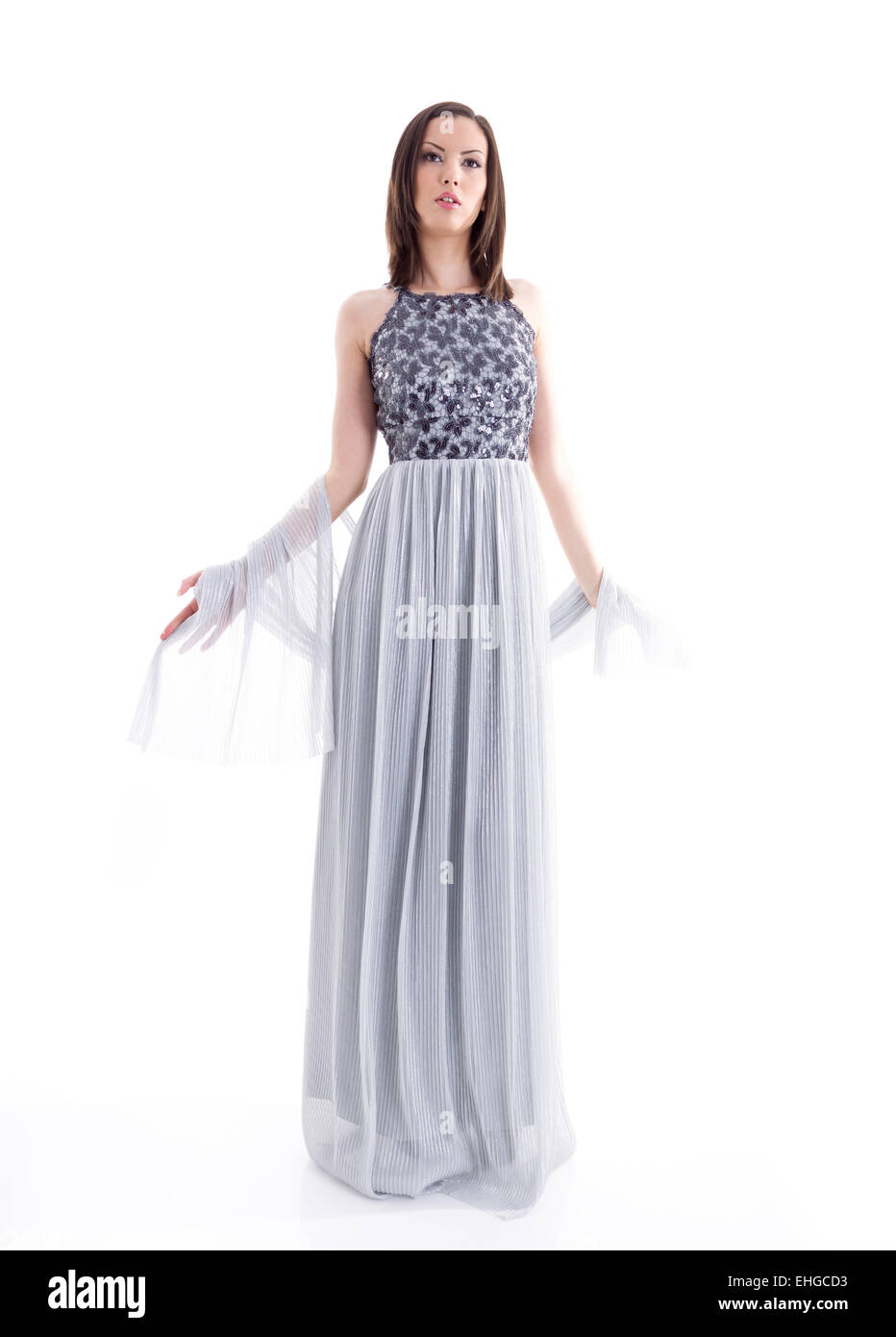 Beautiful woman in a gray dress posing for a photo shoot Stock Photo ...