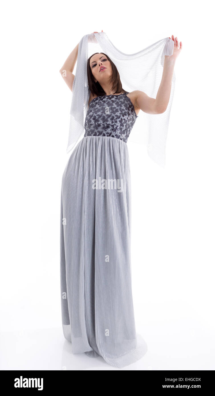 Beautiful woman in a gray dress posing for a photo shoot Stock Photo ...