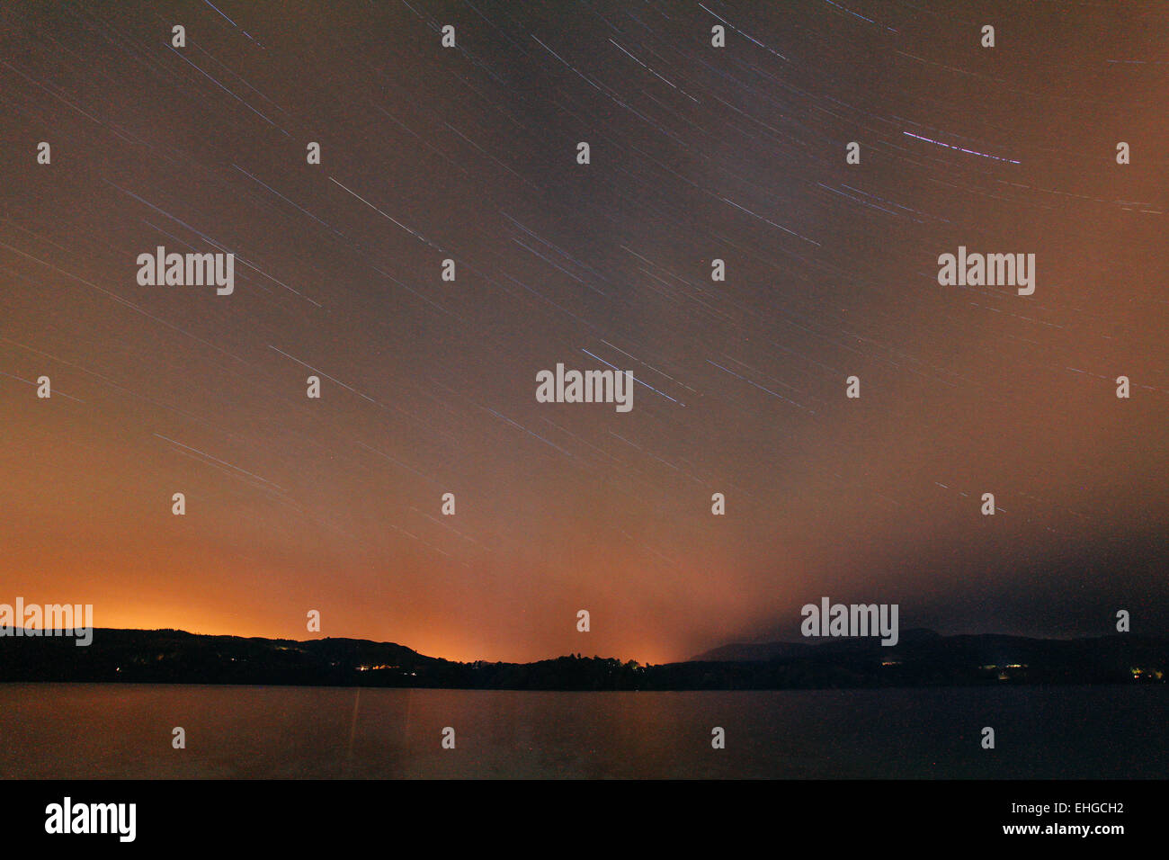Long Exposure at nighttime with stars and clouds Stock Photo - Alamy