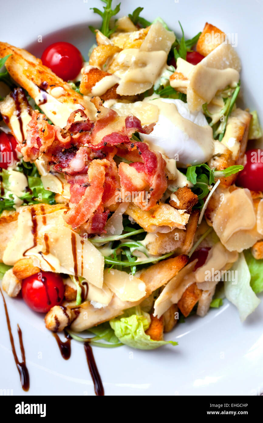Mixed salad with vegetable, egg, bacon, chicken, bread and parmesan ...