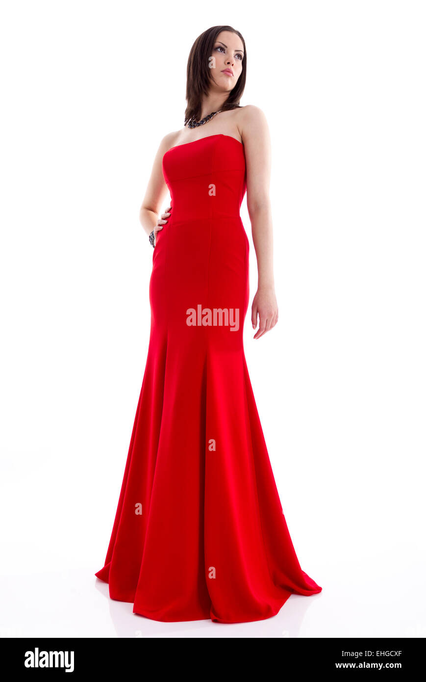 Beautiful woman in a red dress posing for a photo shoot Stock Photo - Alamy