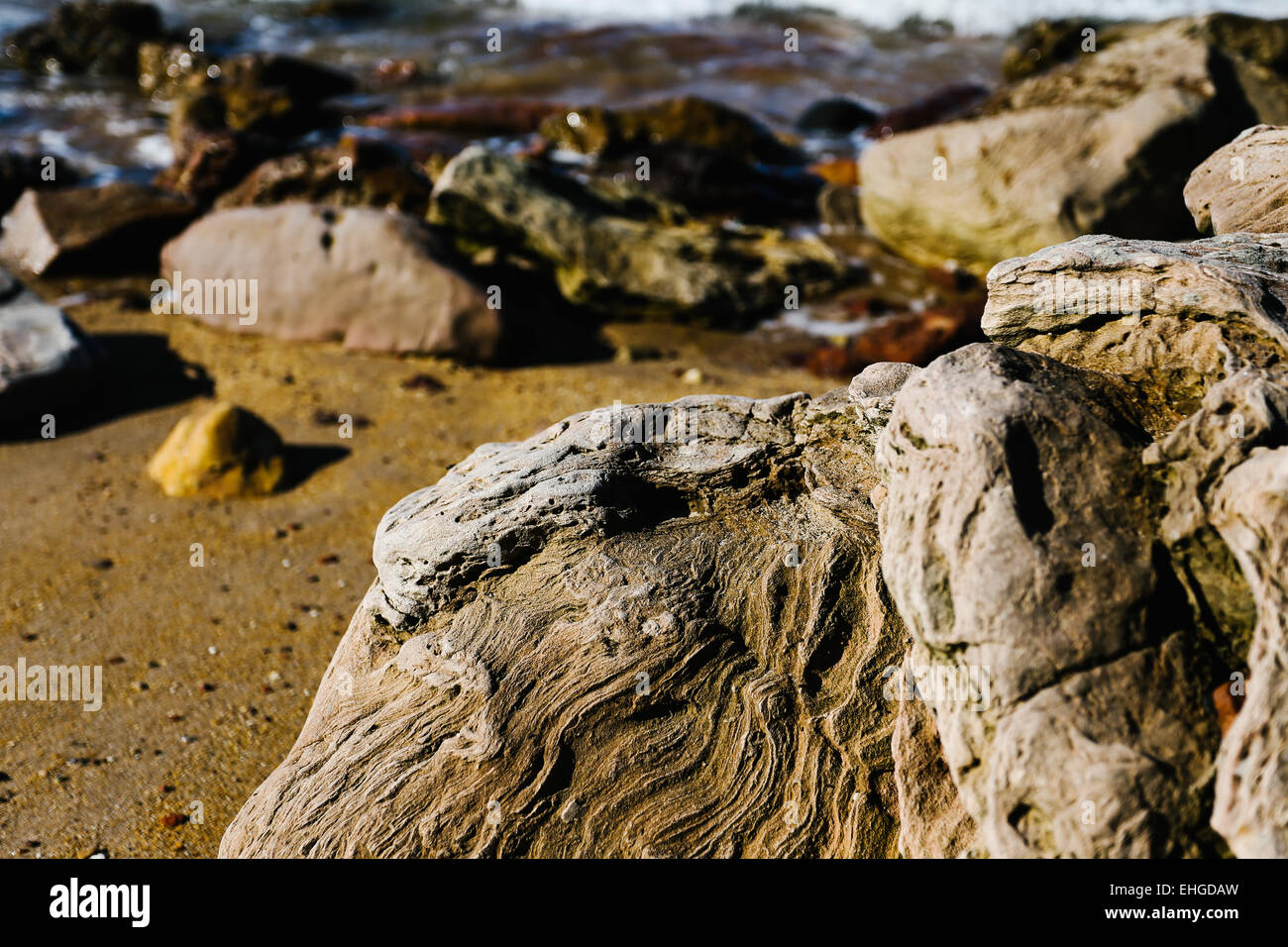 Rocks on the beach in Scotland Stock Photo - Alamy