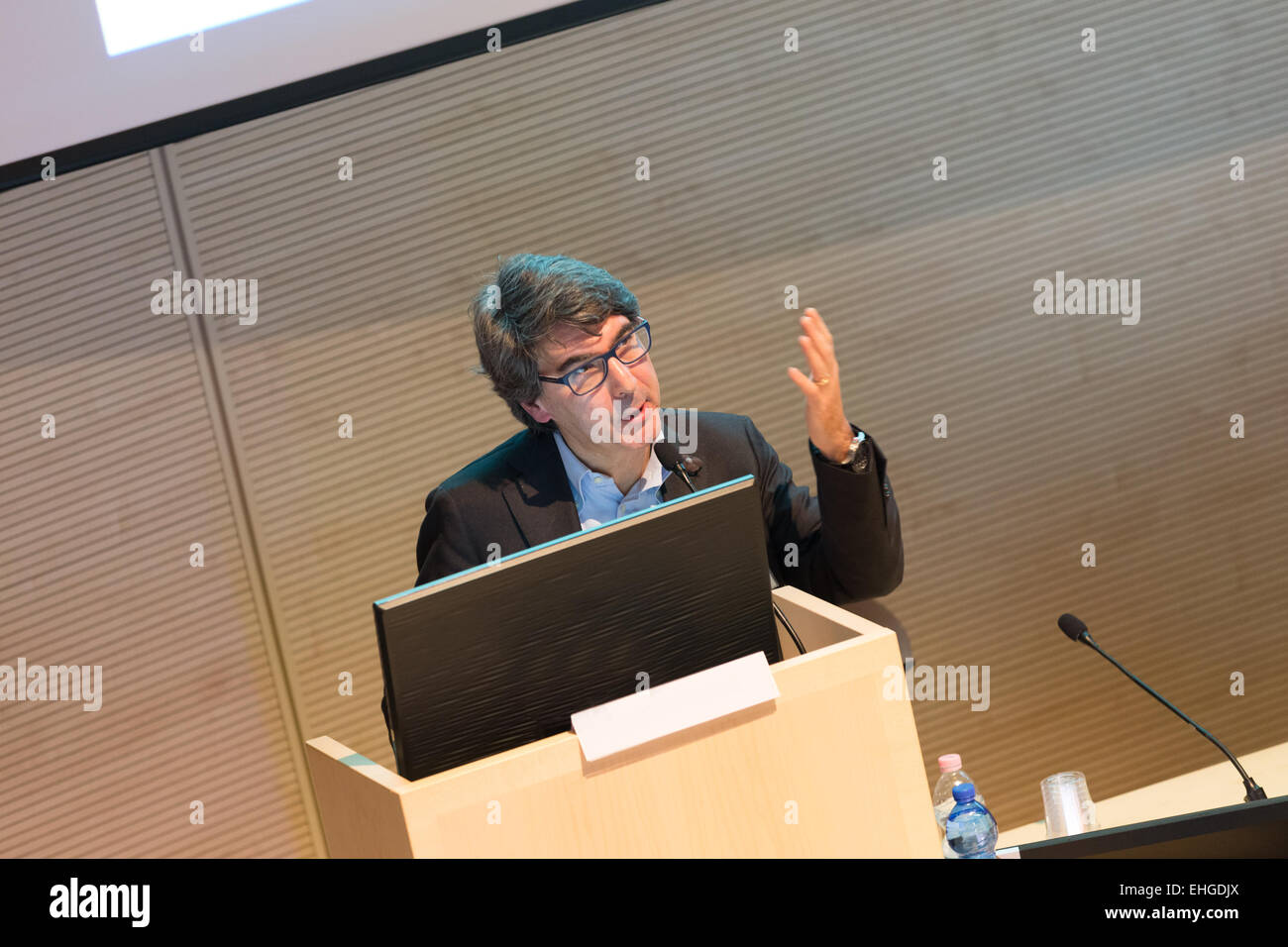 Speaker giving talk on podium at Business Conference Stock Photo - Alamy