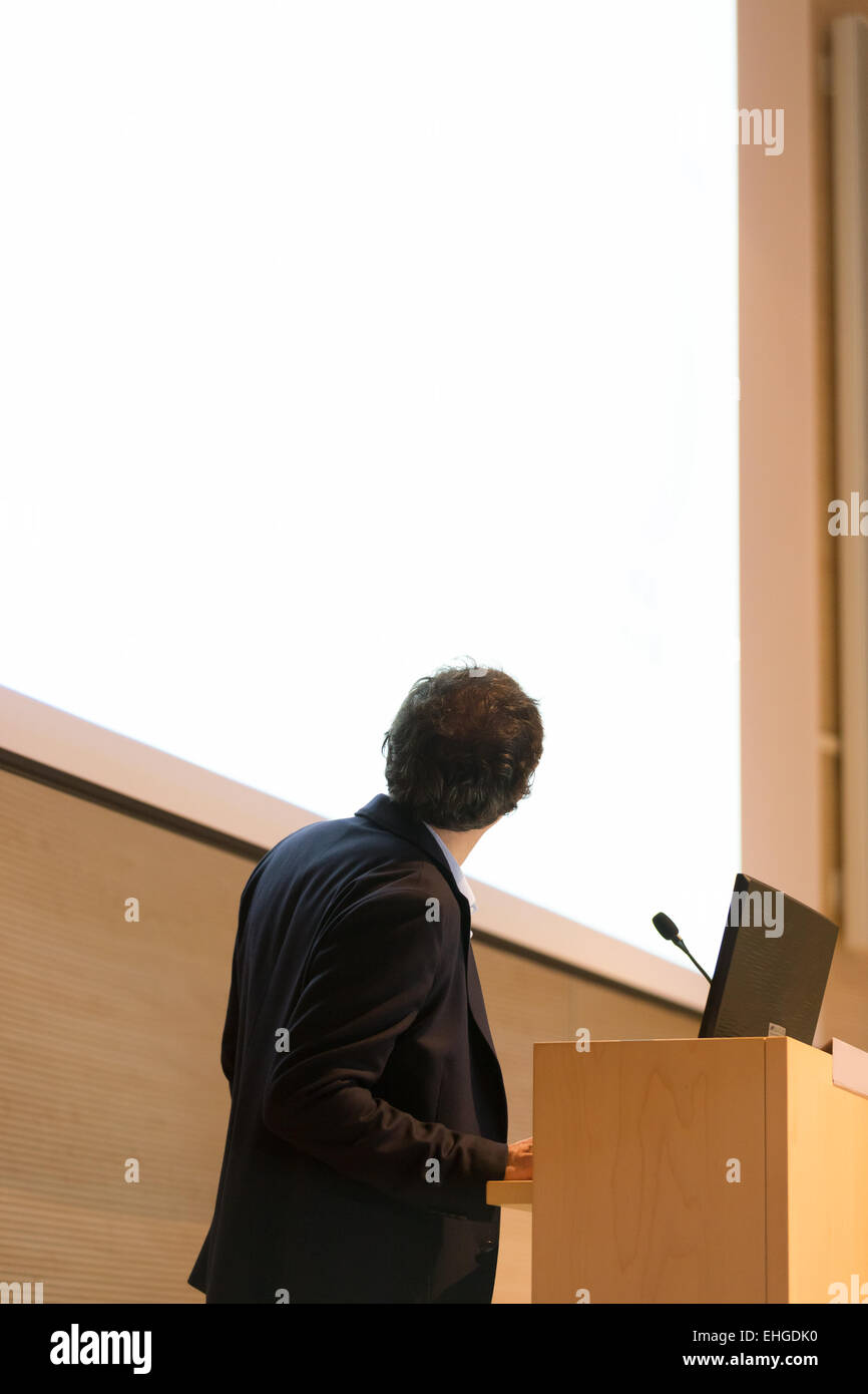Speaker giving talk on podium at Business Conference Stock Photo - Alamy