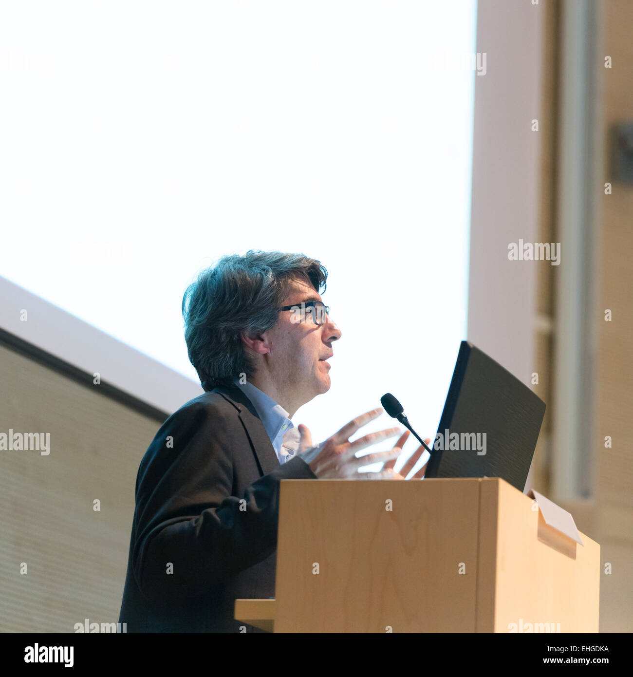 Speaker giving talk on podium at Business Conference Stock Photo - Alamy