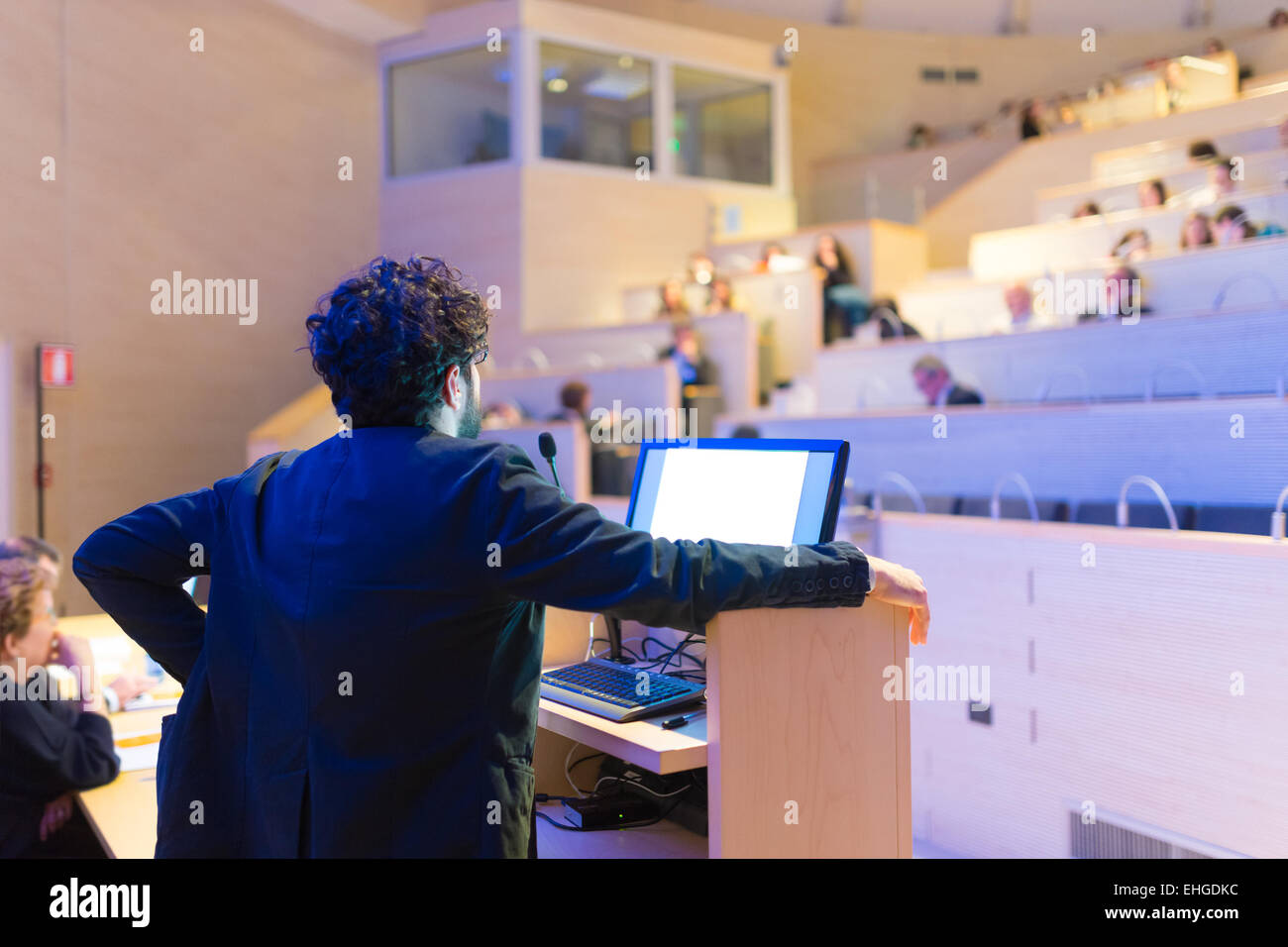 Speaker giving talk on podium at Business Conference Stock Photo - Alamy
