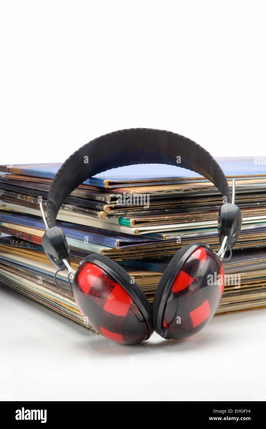 Headphones on stack of old albums Stock Photo - Alamy