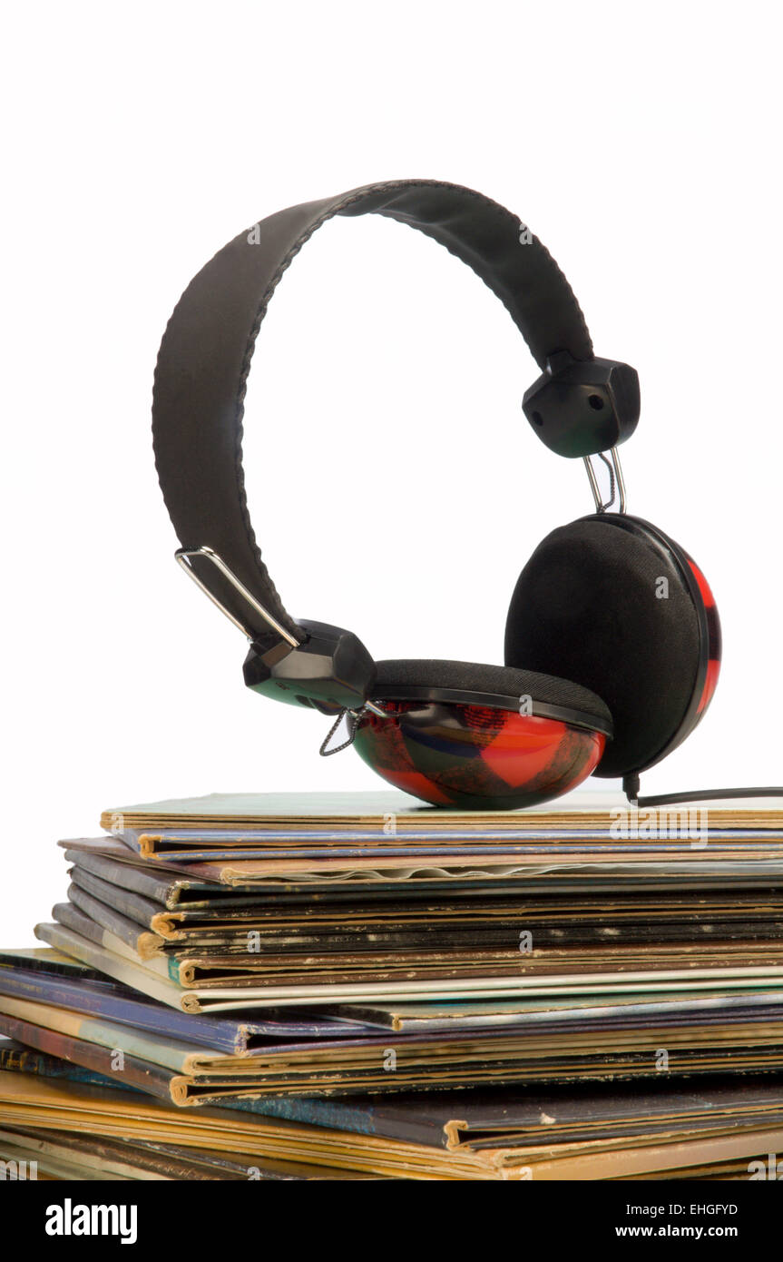 Headphones on stack of old albums Stock Photo - Alamy