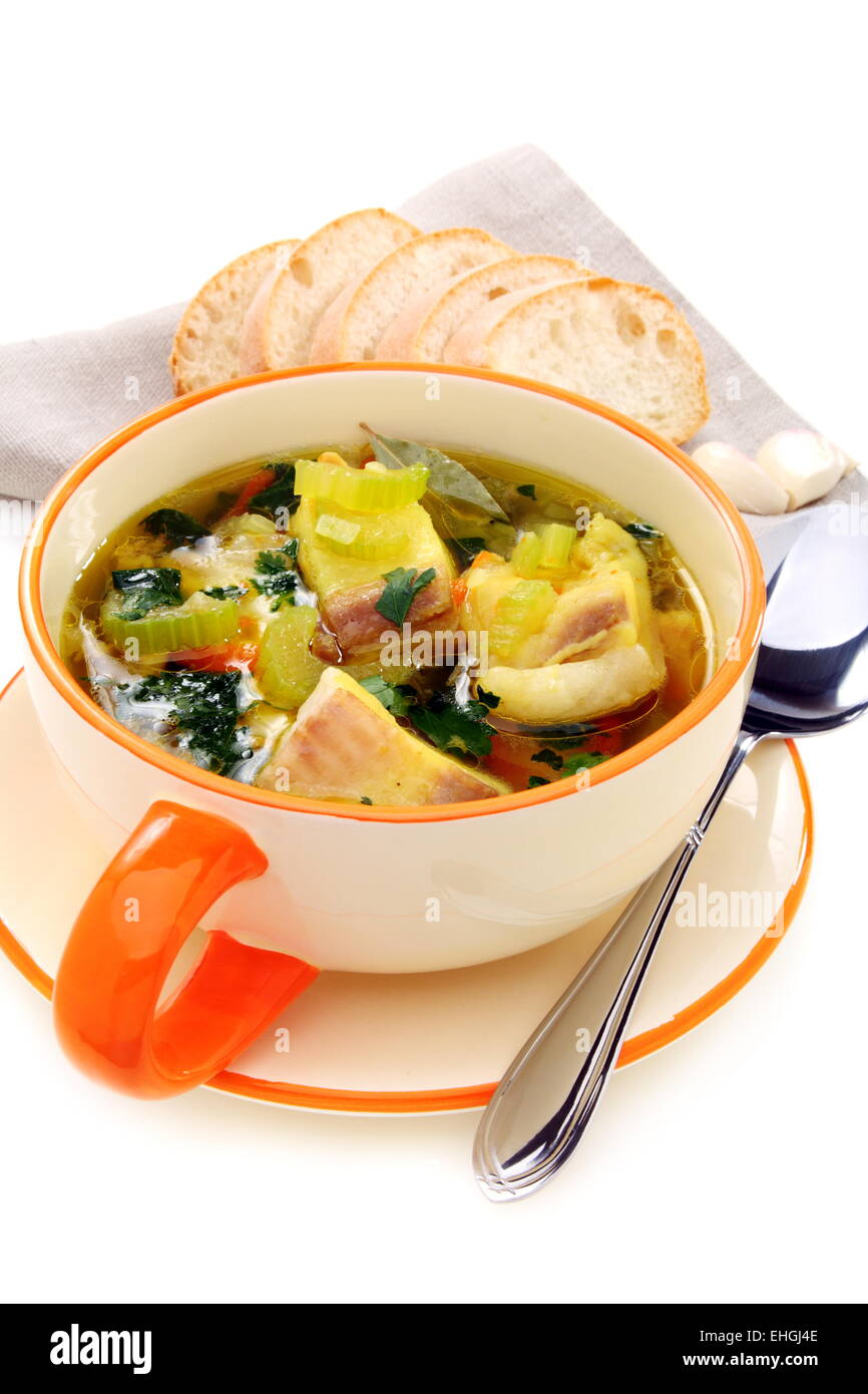 Fish soup in a bowl on a white background Stock Photo - Alamy