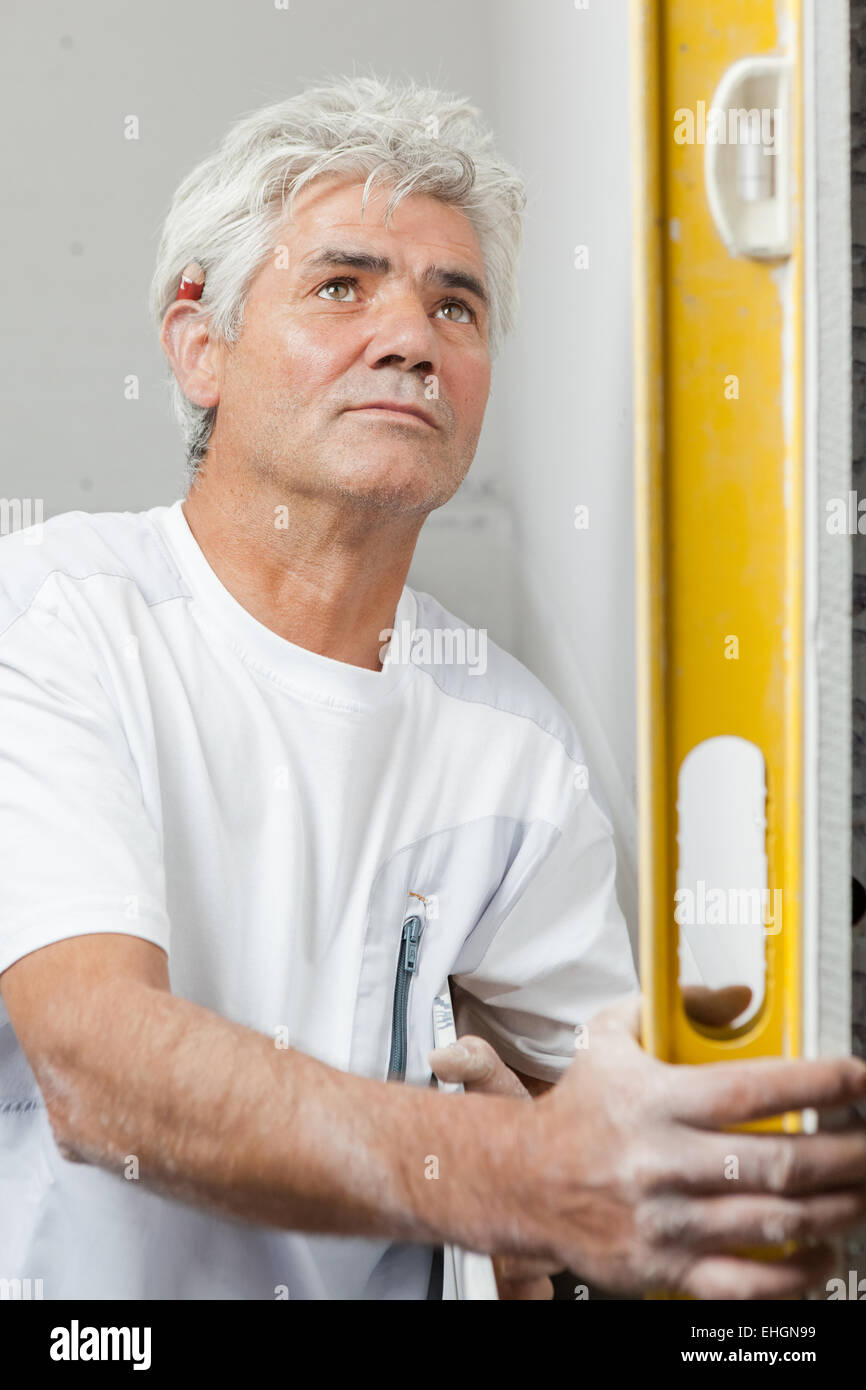 Using a spirit level Stock Photo - Alamy