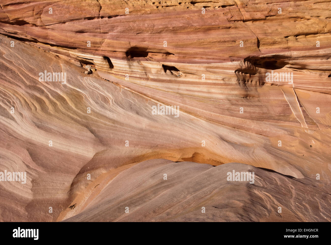 Sandstone erodes leaving color strata Stock Photo - Alamy